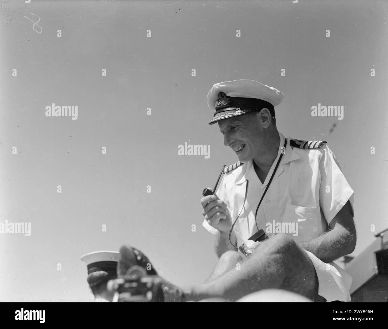 HMS MAURITIUS. JULY 1942. - The Capt of HMS MAURITIUS, on his bridge ...