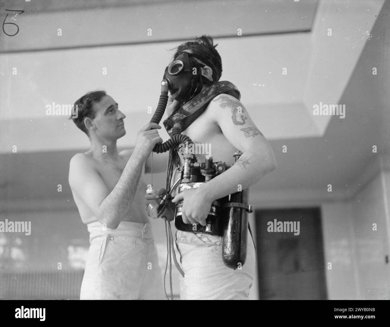 DIVERS TESTING DIVING APPARATUS. OCTOBER 1940, TESTING OUT THE SALVUS ...