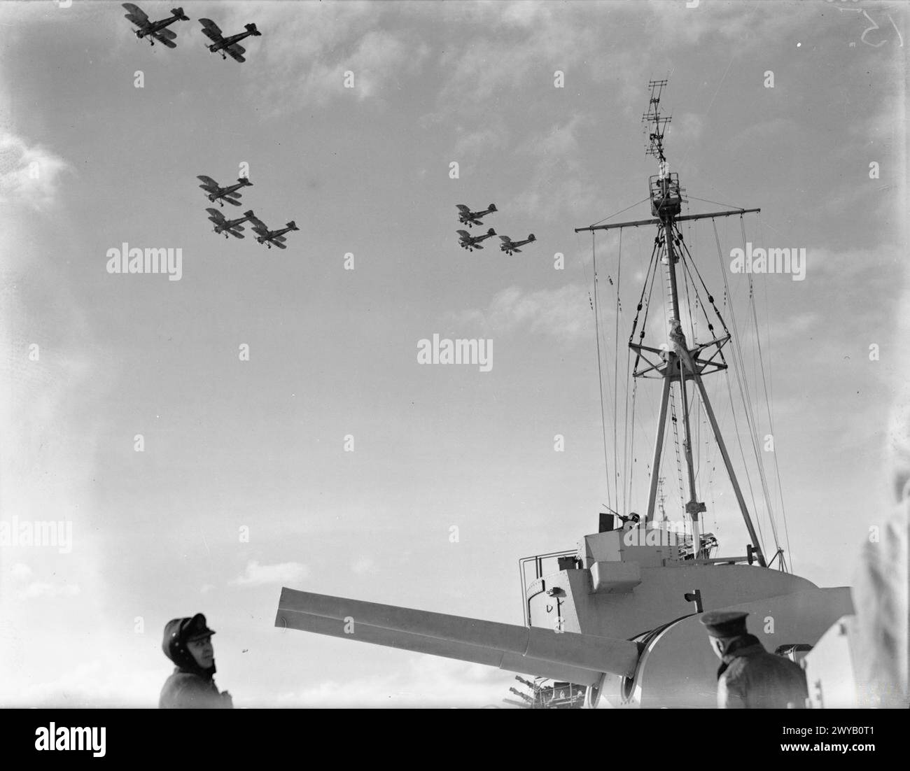 A flight of Fleet Air Arm Fairey Swordfish aircraft flies over the ...