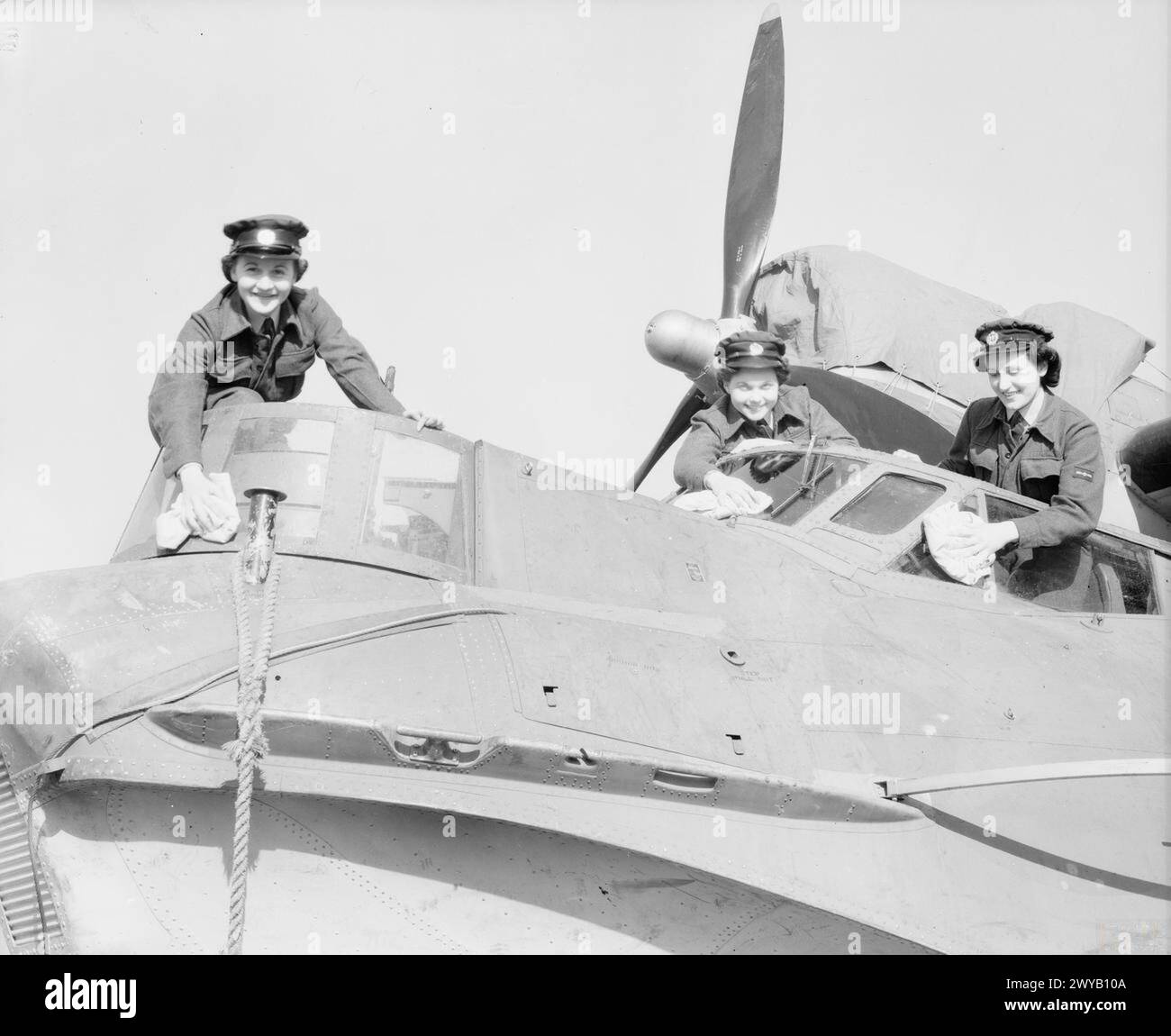 Members of the WAAF apply finishing gloss to a No. 210 Squadron ...