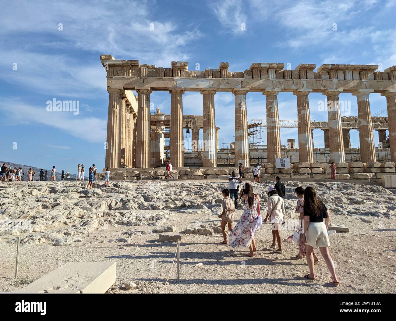 Tourists walk around the Parthenon at the ruins of the Acropolis in Athens Greece Stock Photo ...