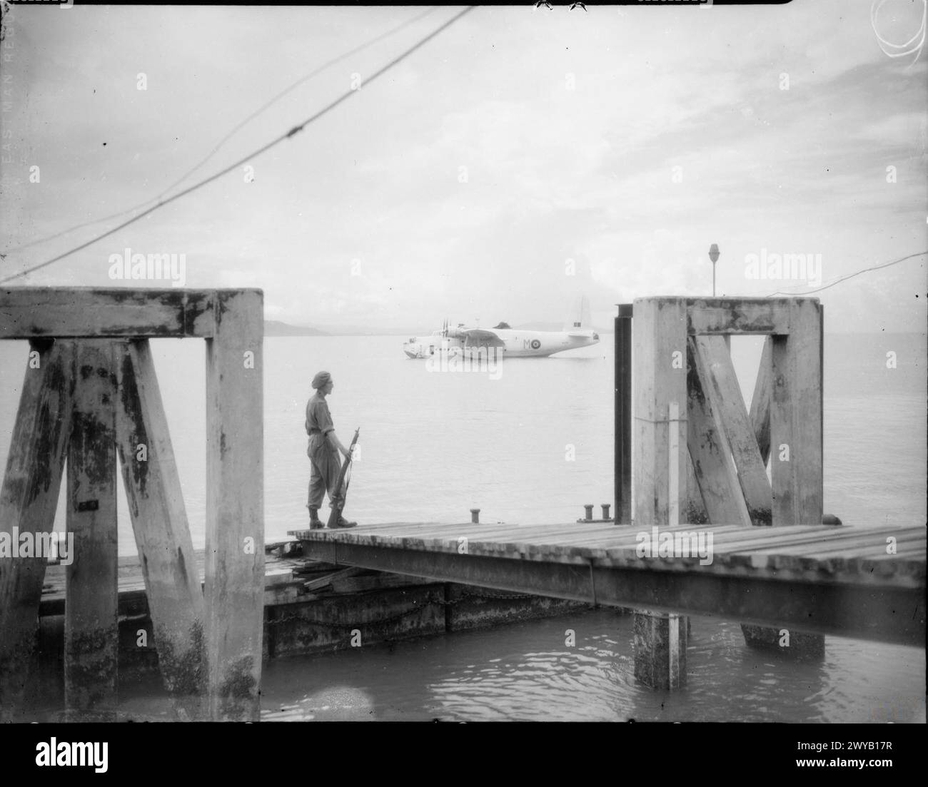 Royal Air Force Regiment sentry stands guard on the jetty at the flying ...