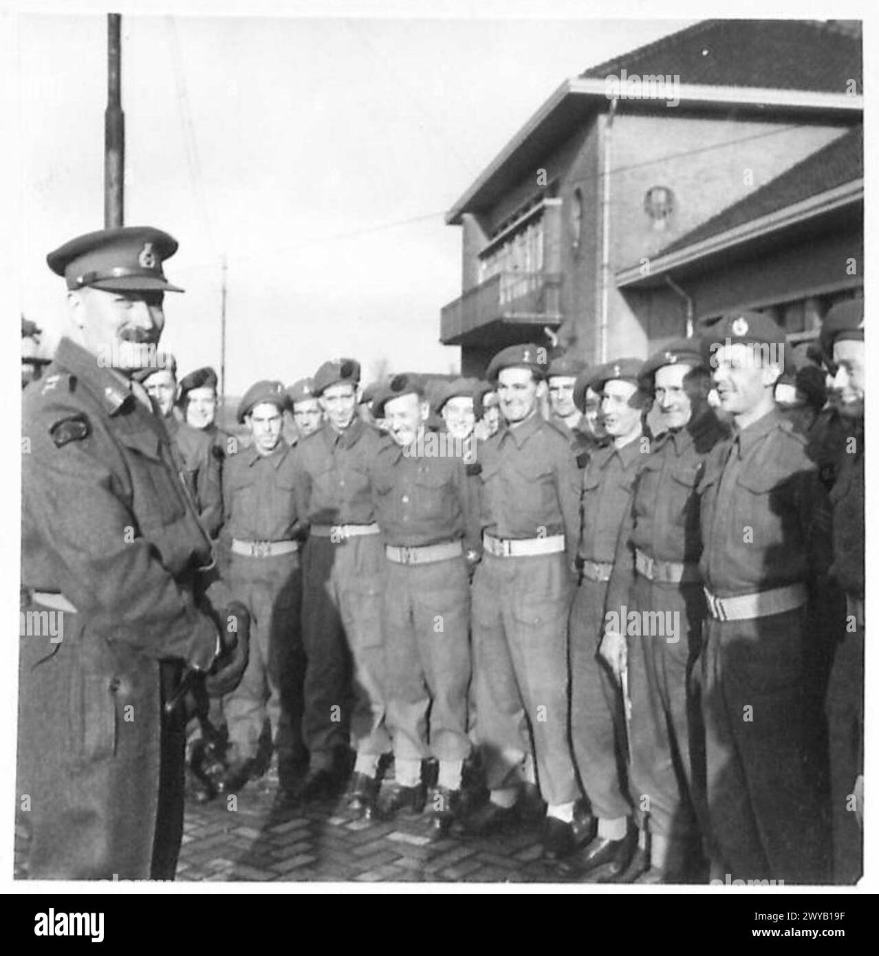 Lieutenant-General Ritchie, GOC 12 Corps, poses with soldiers who have ...