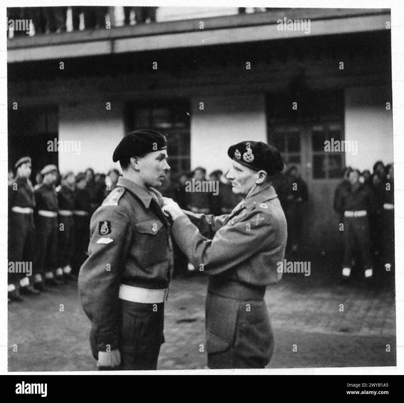 "DESERT RATS" INVESTITURE - Original wartime caption: Capt J. Garnett ...