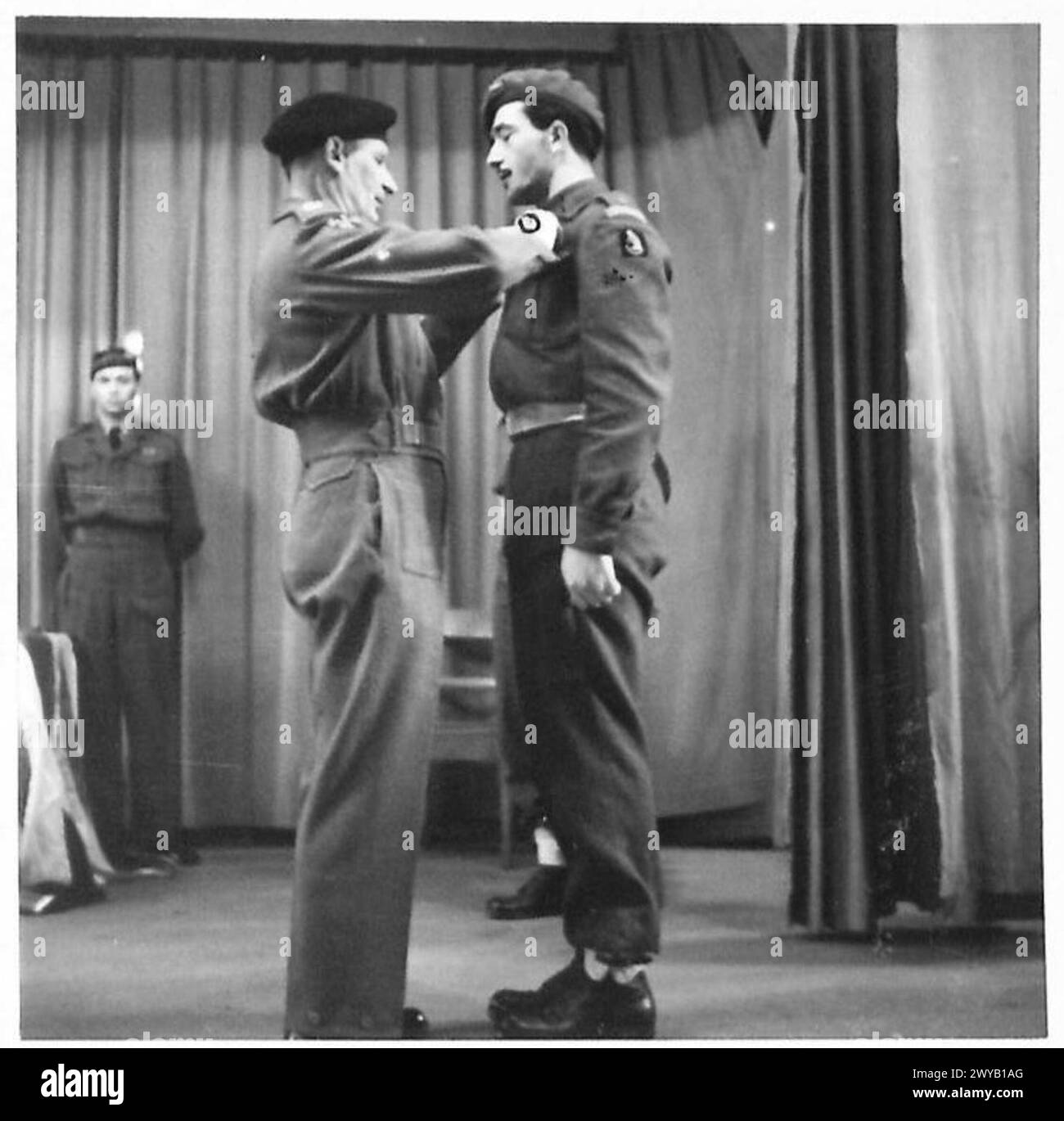 INVESTITURE BY FIELD MARSHAL MONTGOMERY - Original wartime caption: 2 ...