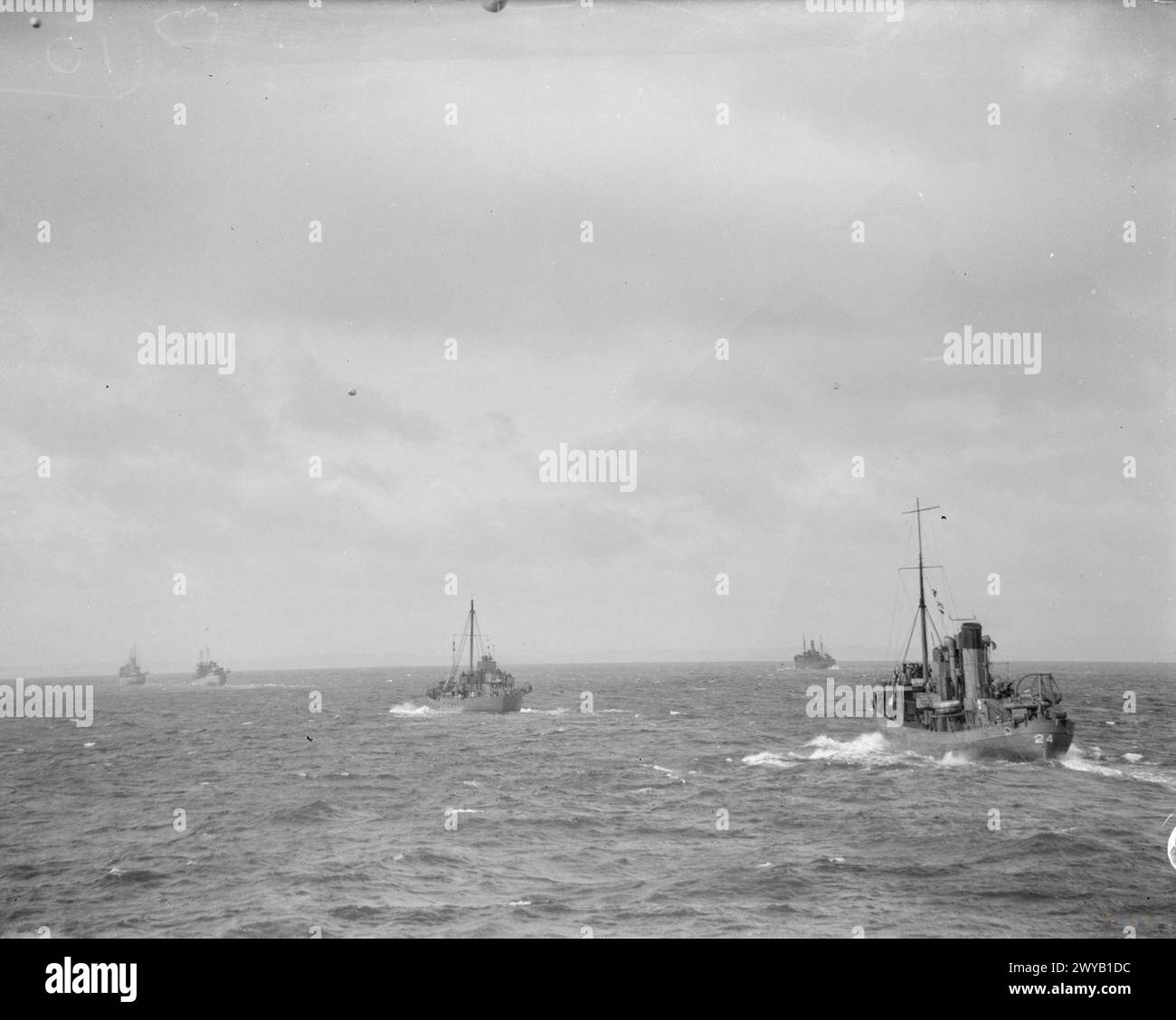Crew of HMS Cornelian, a British trawler, shoots down a Heinkel and a ...