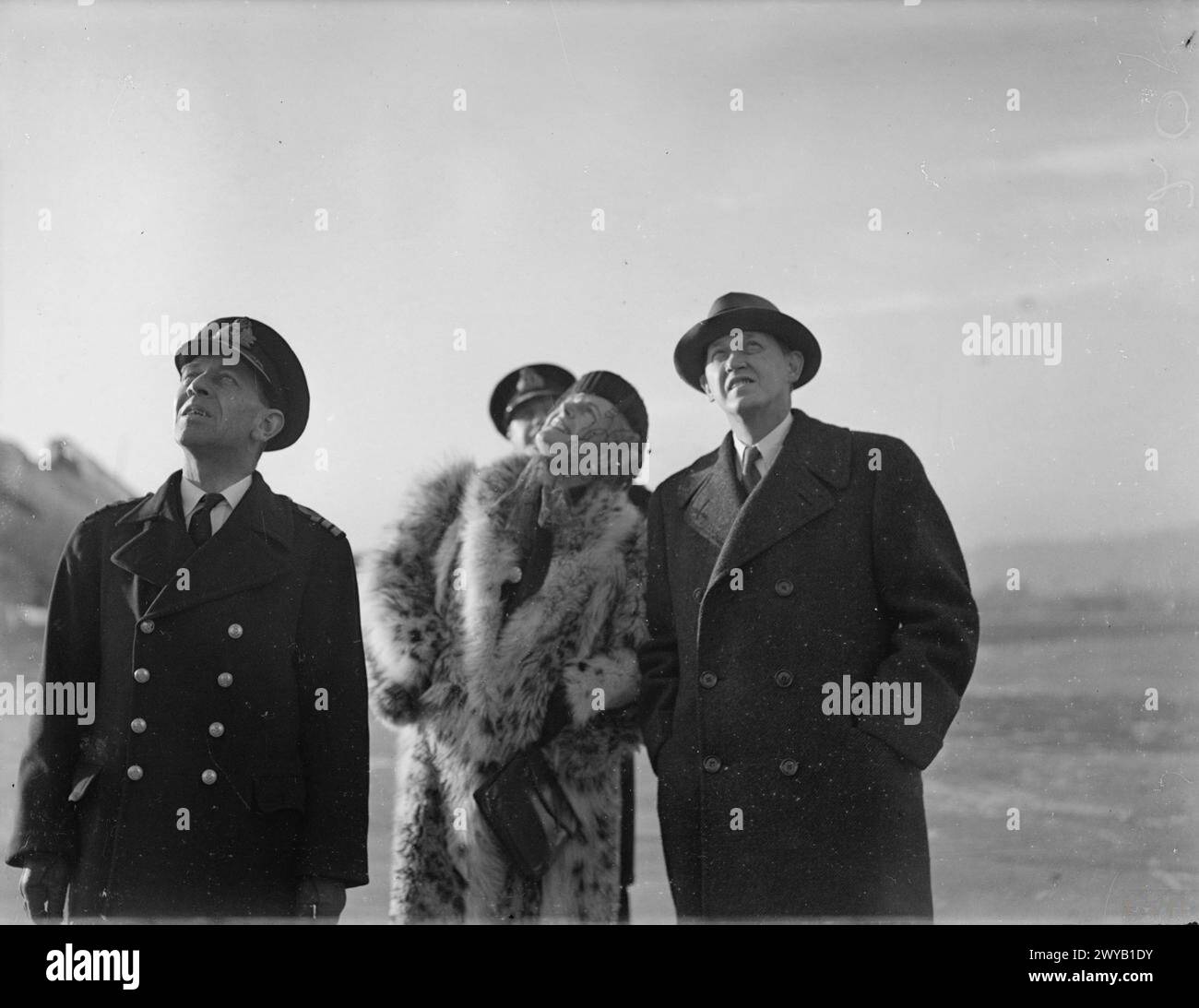 Mrs. Churchill and Mr. Harry Hopkins observe American aircraft in ...