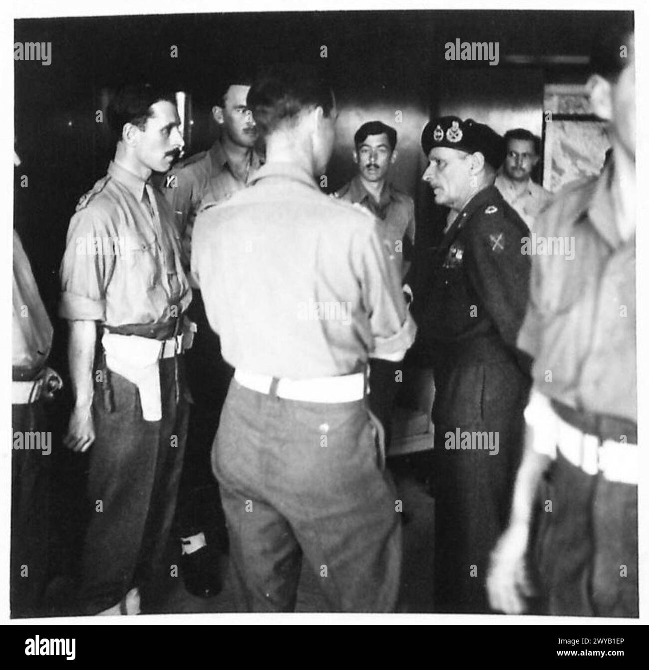 C-IN-C VISITS 5 DIVISION - Original wartime caption: The C-in-C ...