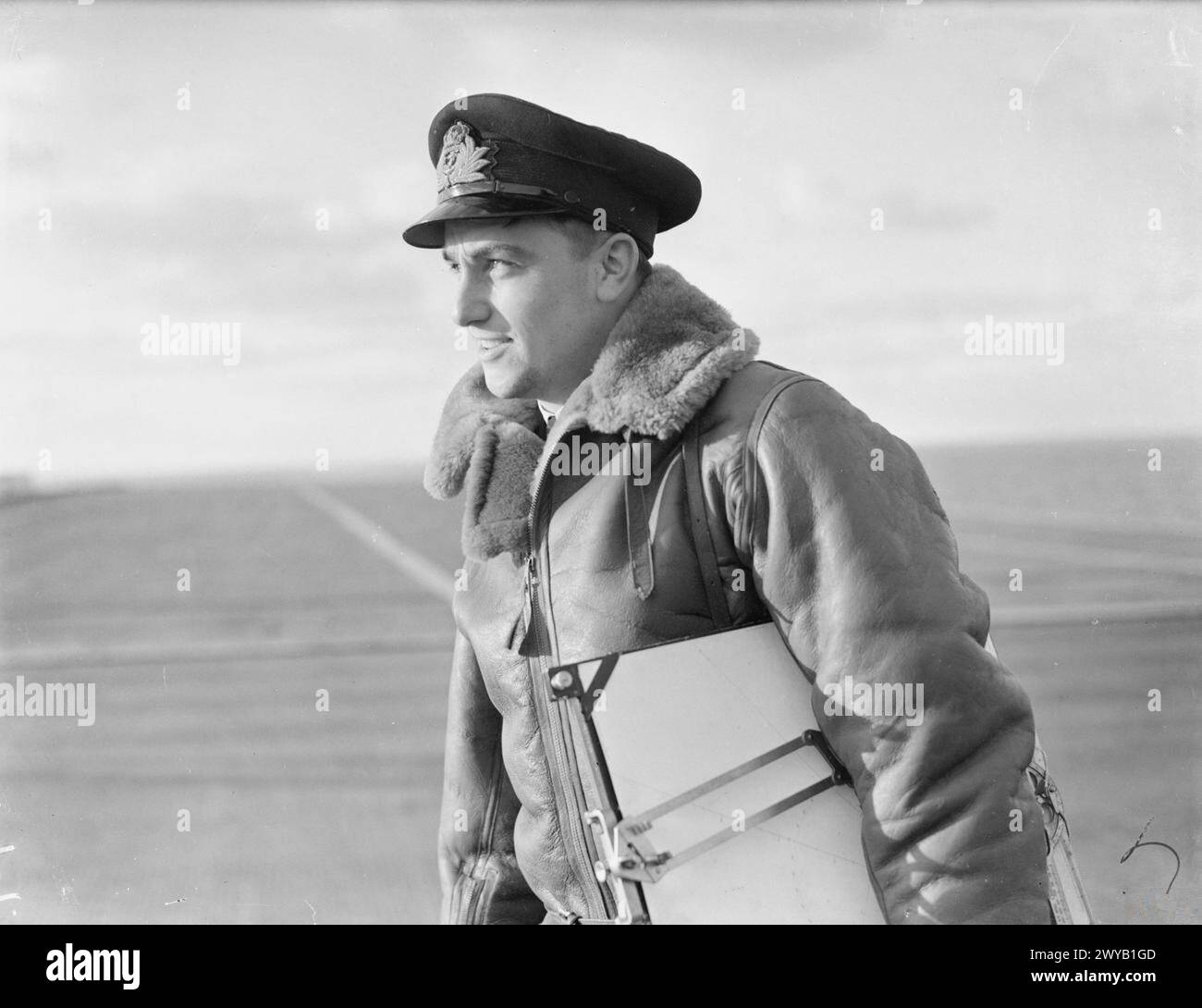 ON BOARD THE AIRCRAFT CARRIER HMS ARGUS. 1940. - An observer with his ...
