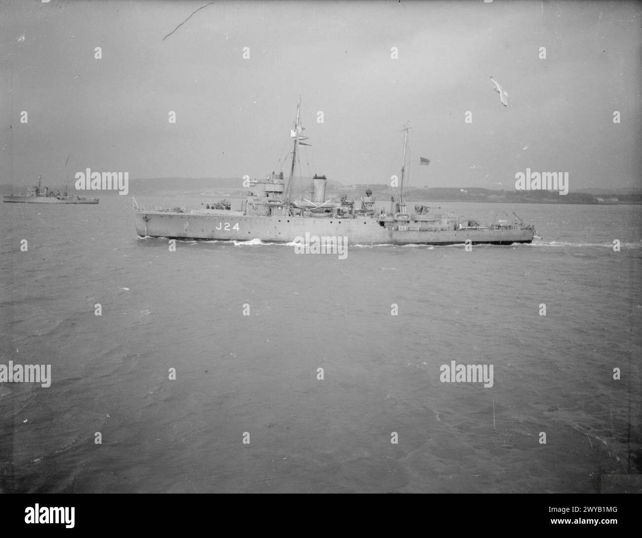 THE ROYAL NAVY DURING THE SECOND WORLD WAR - The minesweeper HMS HEBE, seen from HMS RODNEY ...