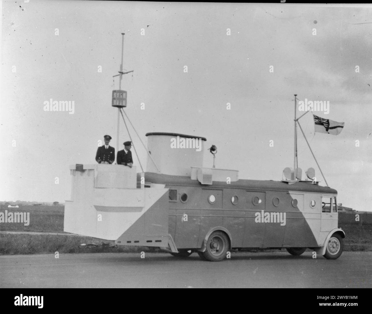 Royal Navy officers are aboard HMS Spurious Mark II, a bus converted to ...