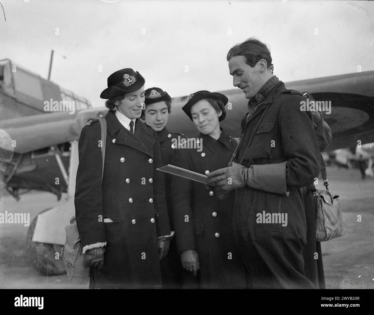 WRNS personnel at a Fleet Air Arm station in 1940 converse with their ...