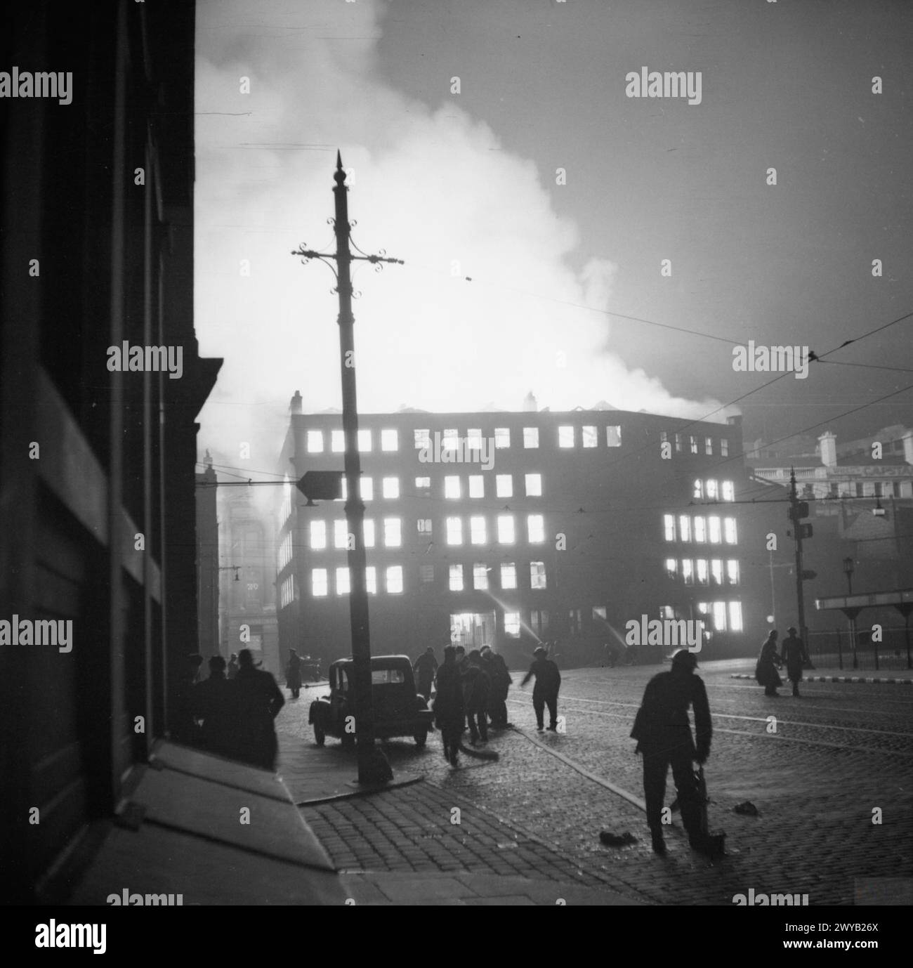 Buildings near a bus station in Manchester burn following a German air ...