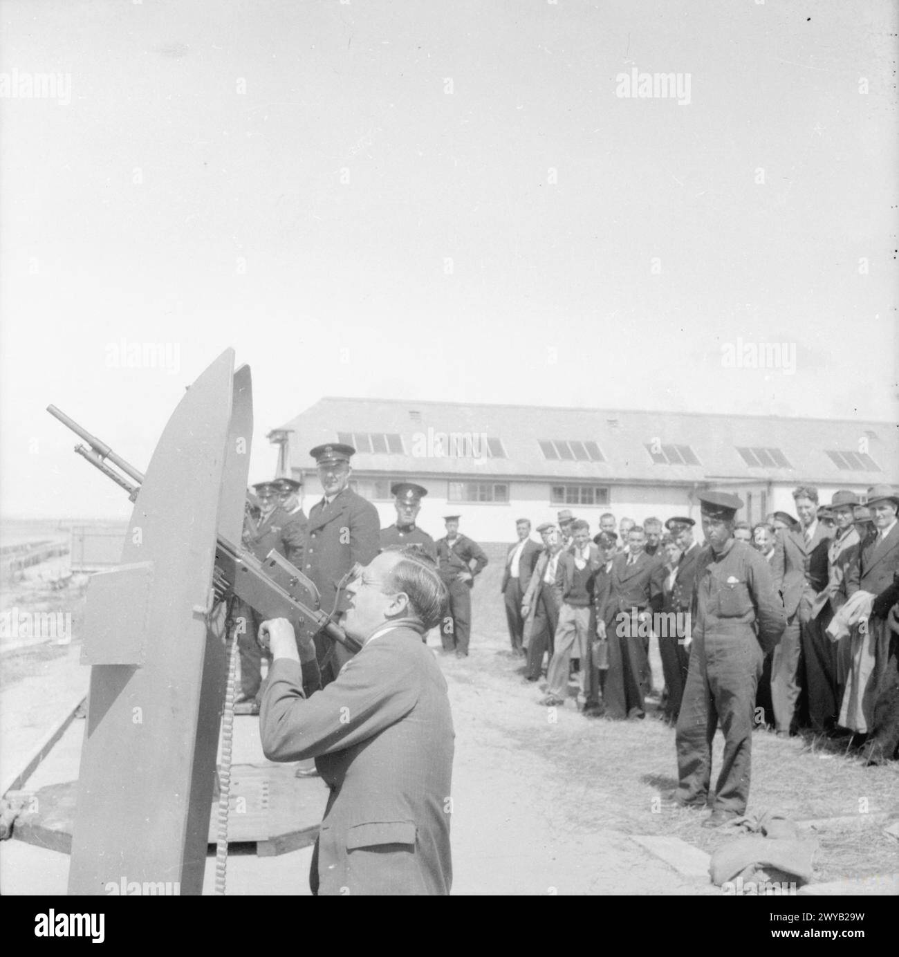 In 1941, a cadet of the Royal Merchant Navy fires a marlin gun on the ...