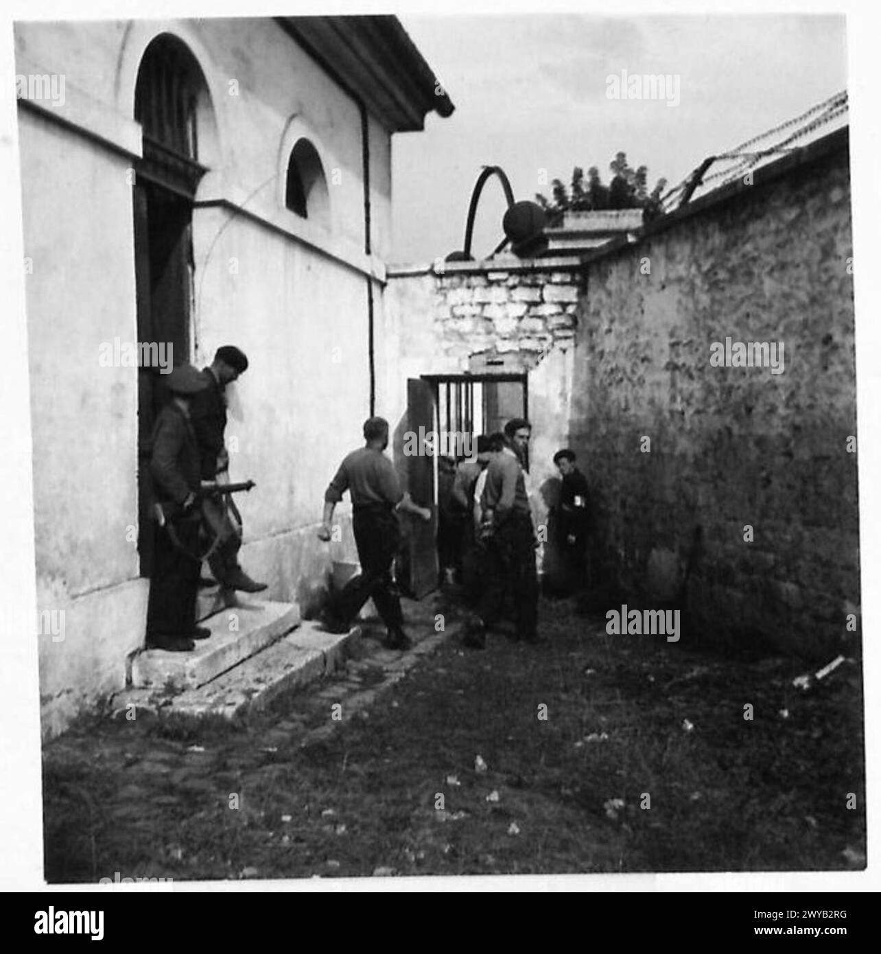 FFI IN VERNON - Original wartime caption: Guarded by armed FFI the ...