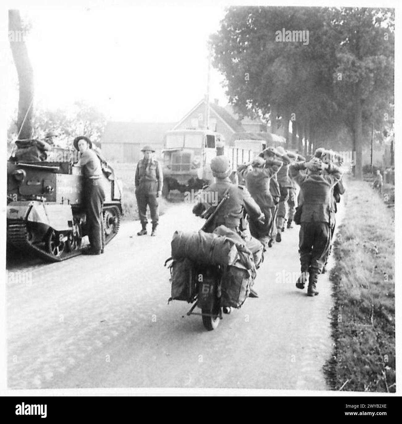 CROSSING THE BELGIUM DUTCH BORDER AT HAMONT. - Original wartime caption ...