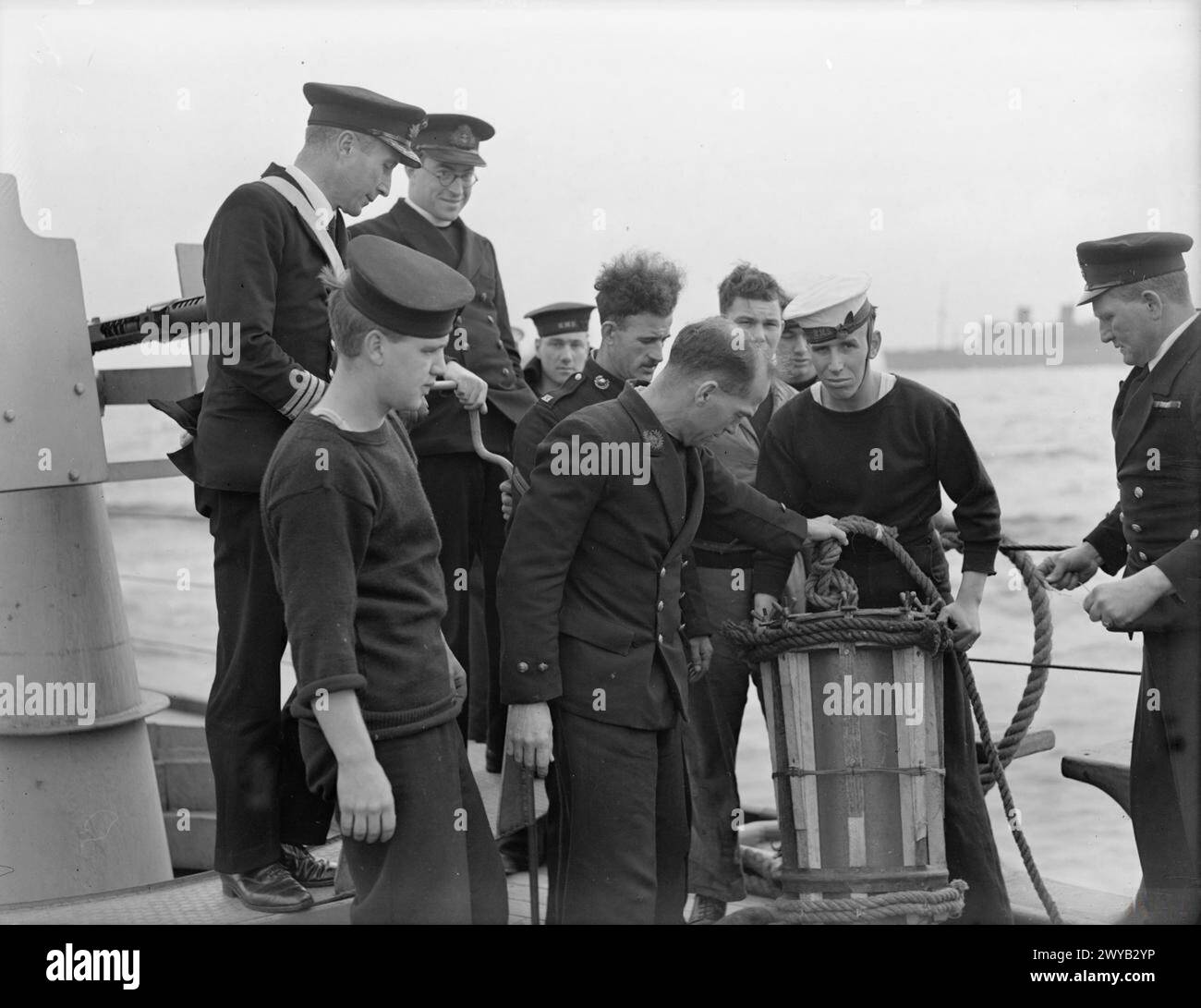 DELIVERING THE MAIL TO A DESTROYER AT SEA. 20 MAY 1942, ON BOARD THE ...