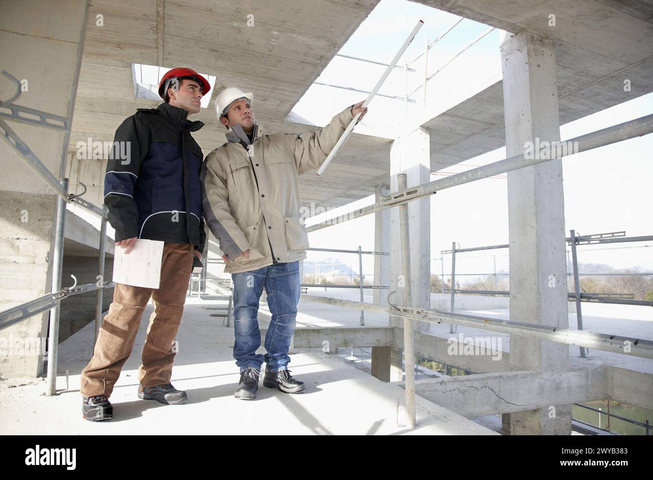 Architect and construction worker, personal protective equipment ...