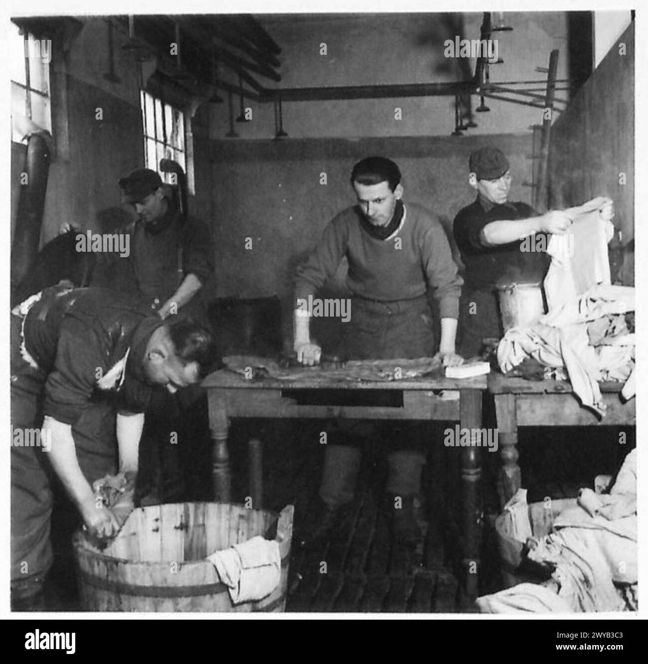 PS. C W - Original wartime caption: Part of the laundry arrangements ...