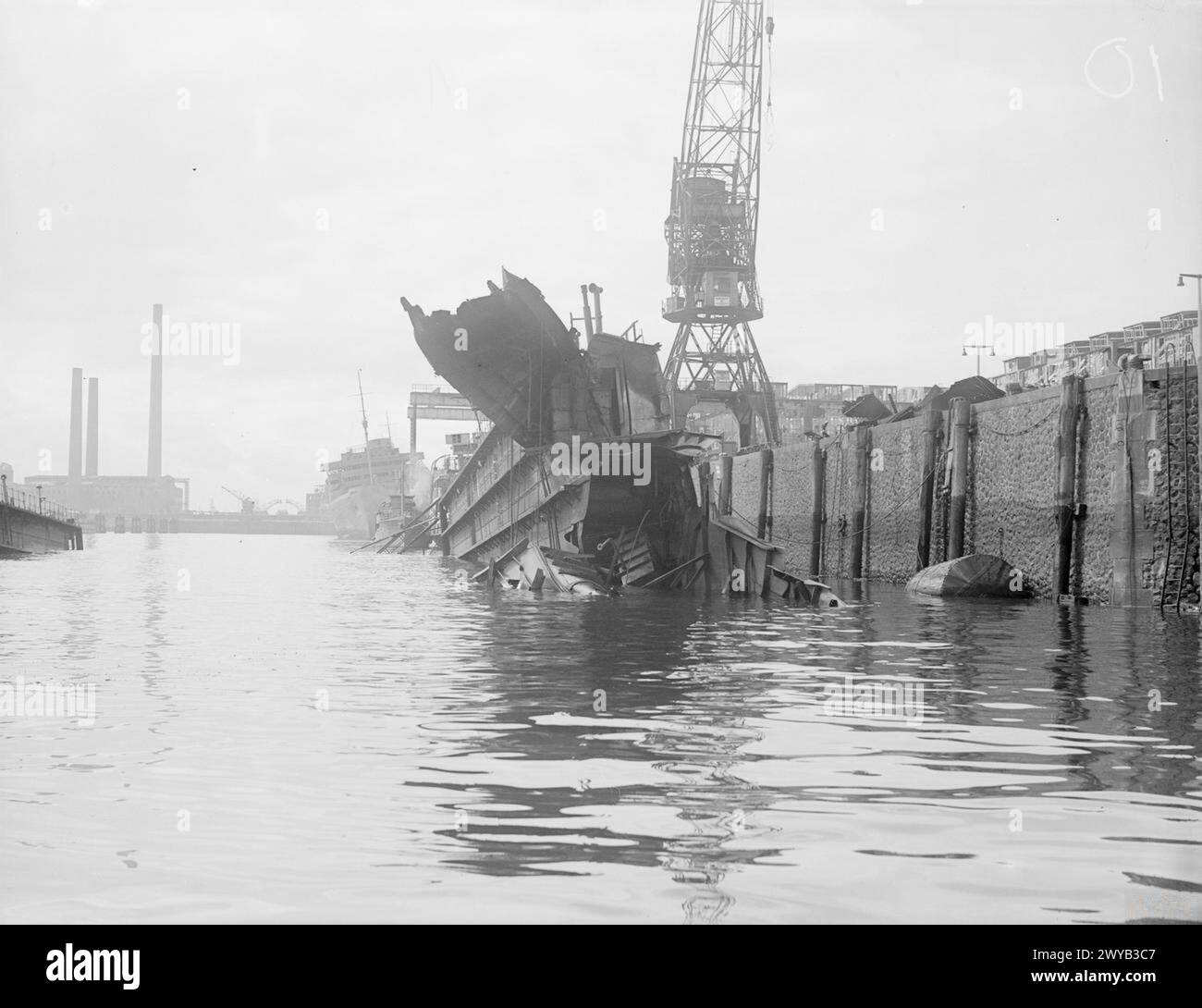 Wrecked and burnt-out German ships, including the Robert Ley, are seen ...