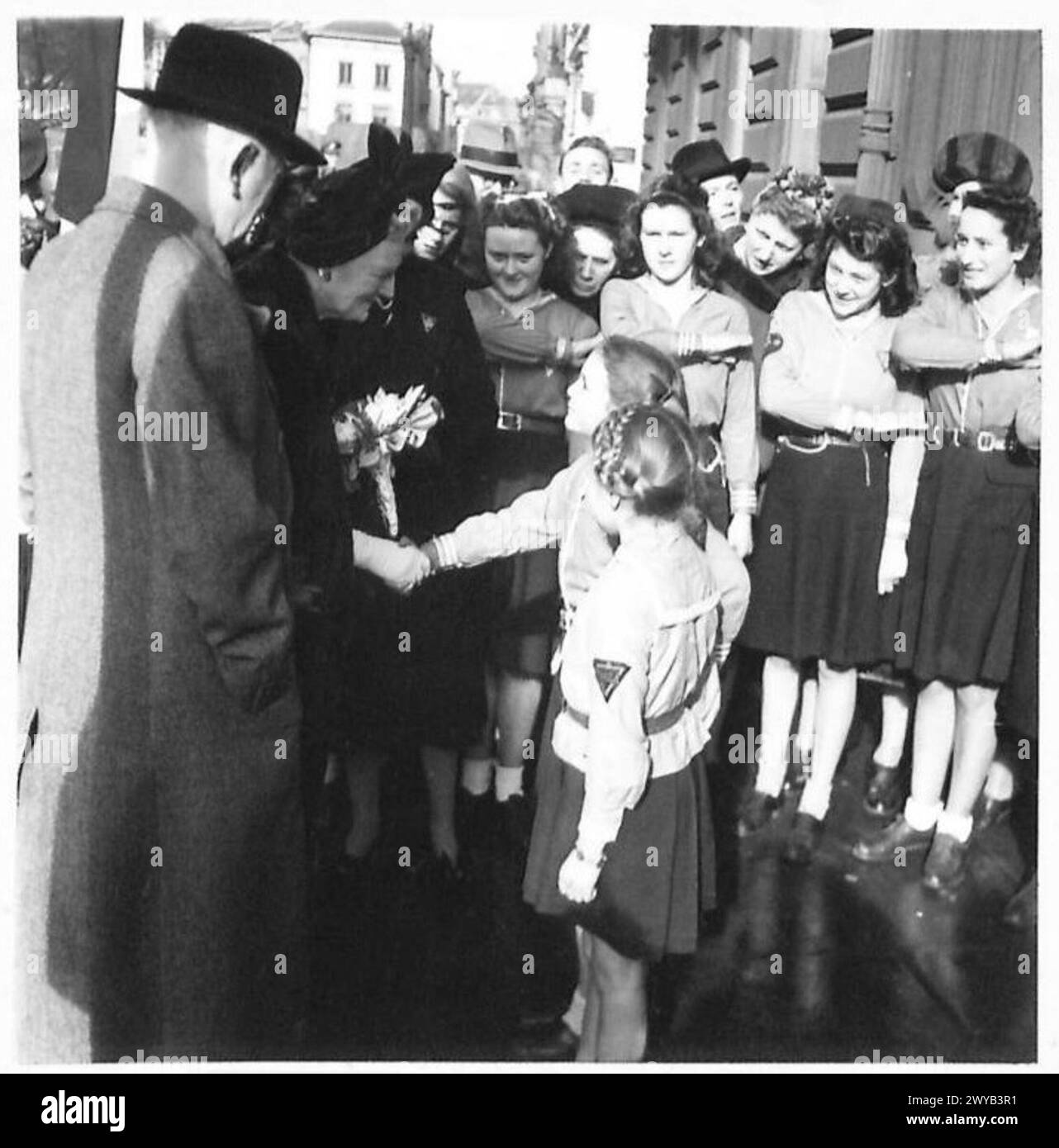 MRS CHURCHILL IN BRUSSELS - Original wartime caption: Receiving a ...