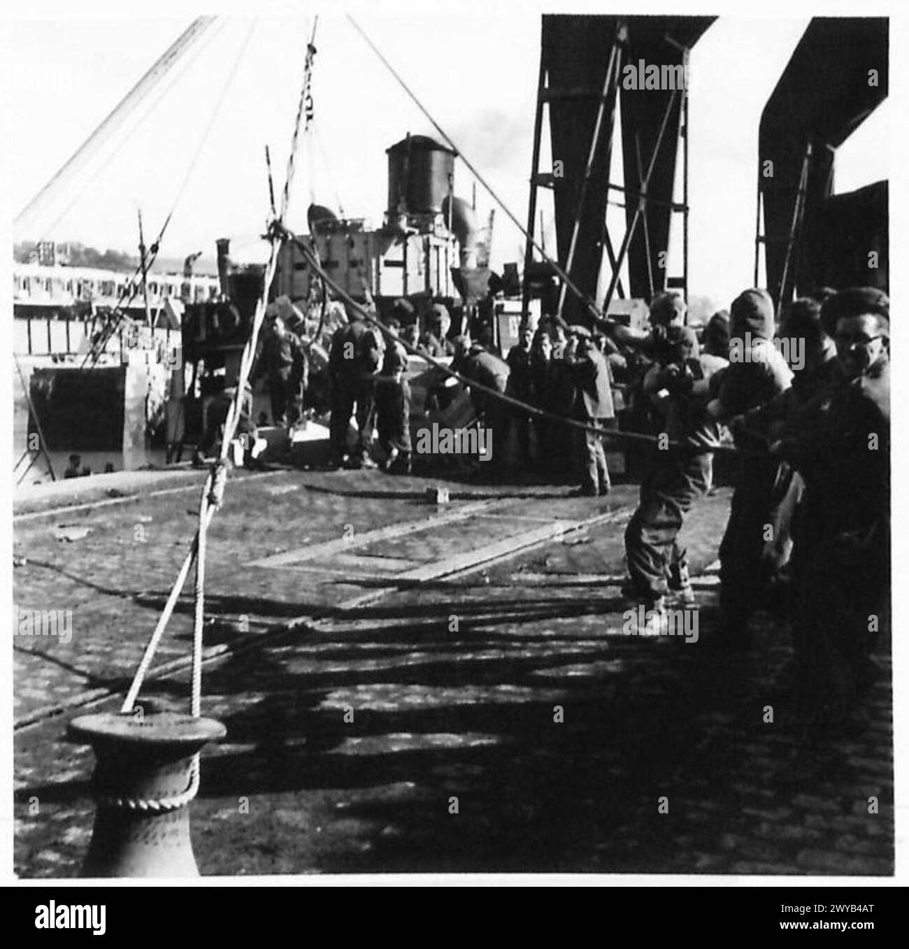 DIEPPE. - Original wartime caption: Bringing in a loaded rope baset ...