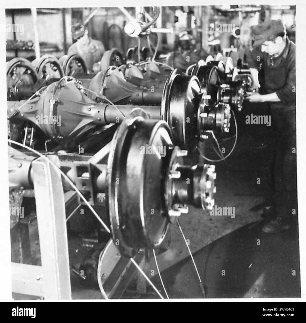 FORD WORKS AT COLOGNE - Original wartime caption: Rear axles are ...