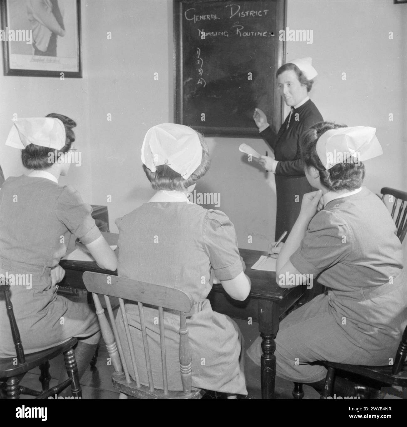 Trainees attend a lecture on general district nursing routines given by ...