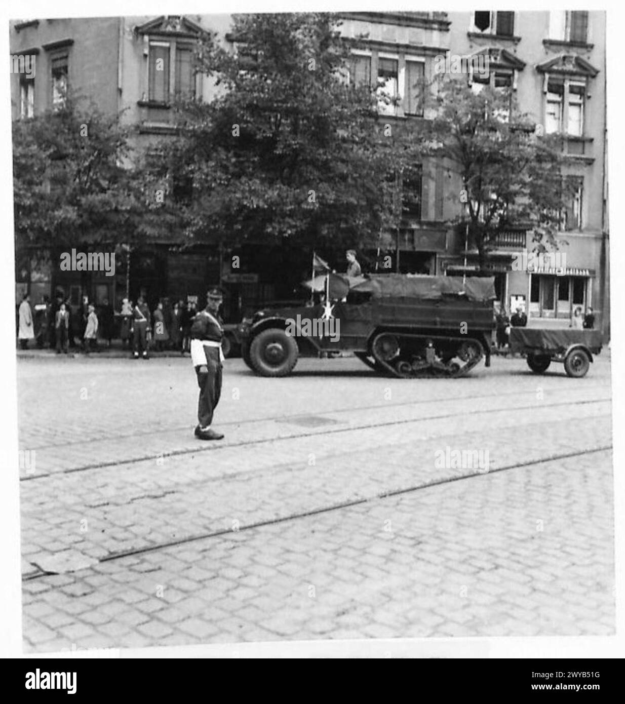 BRITISH ENTRY INTO BERLIN - Original wartime caption: Berliners watch ...