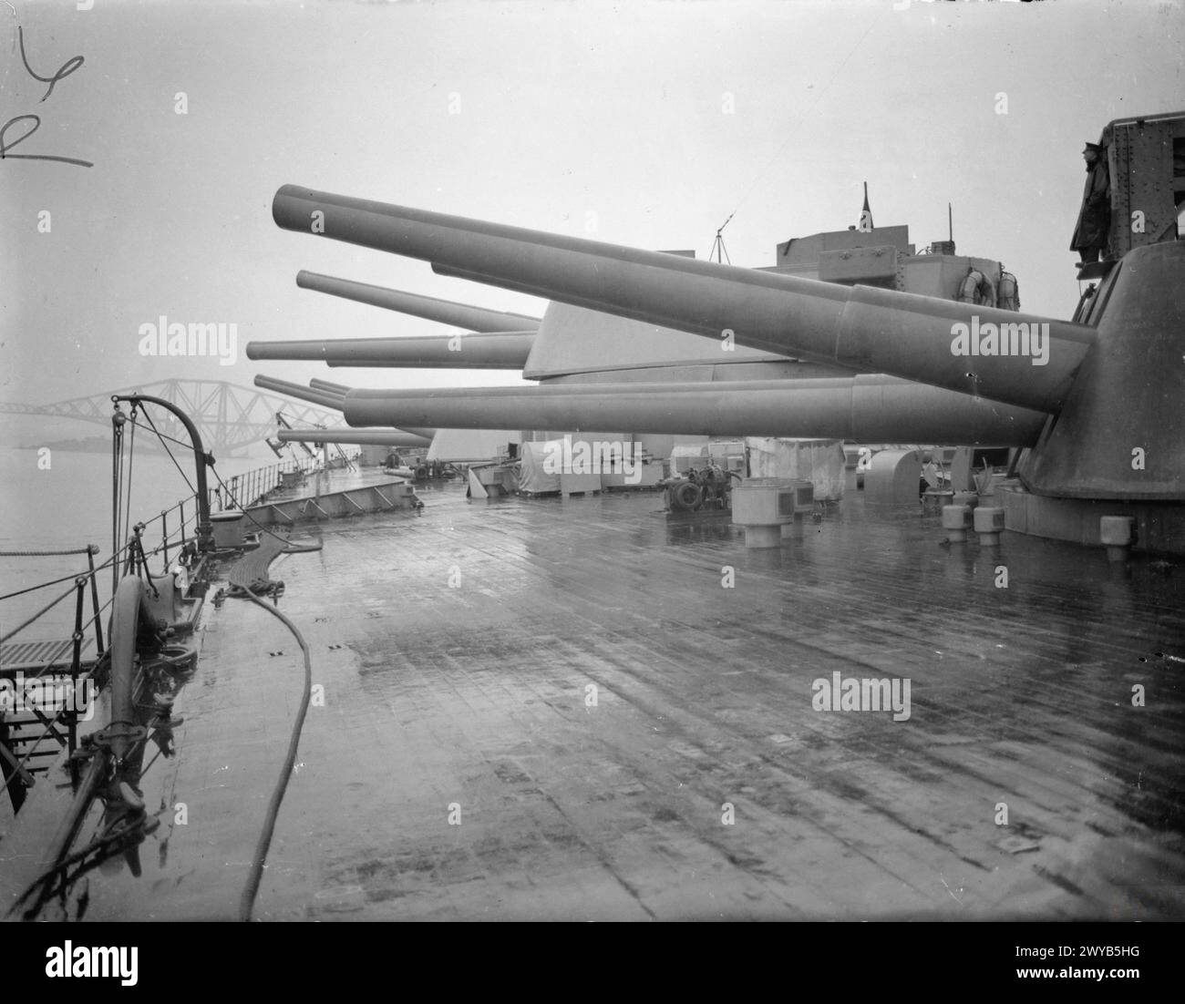 Guns of HMS Rodney trained on the port side during general quarters in ...