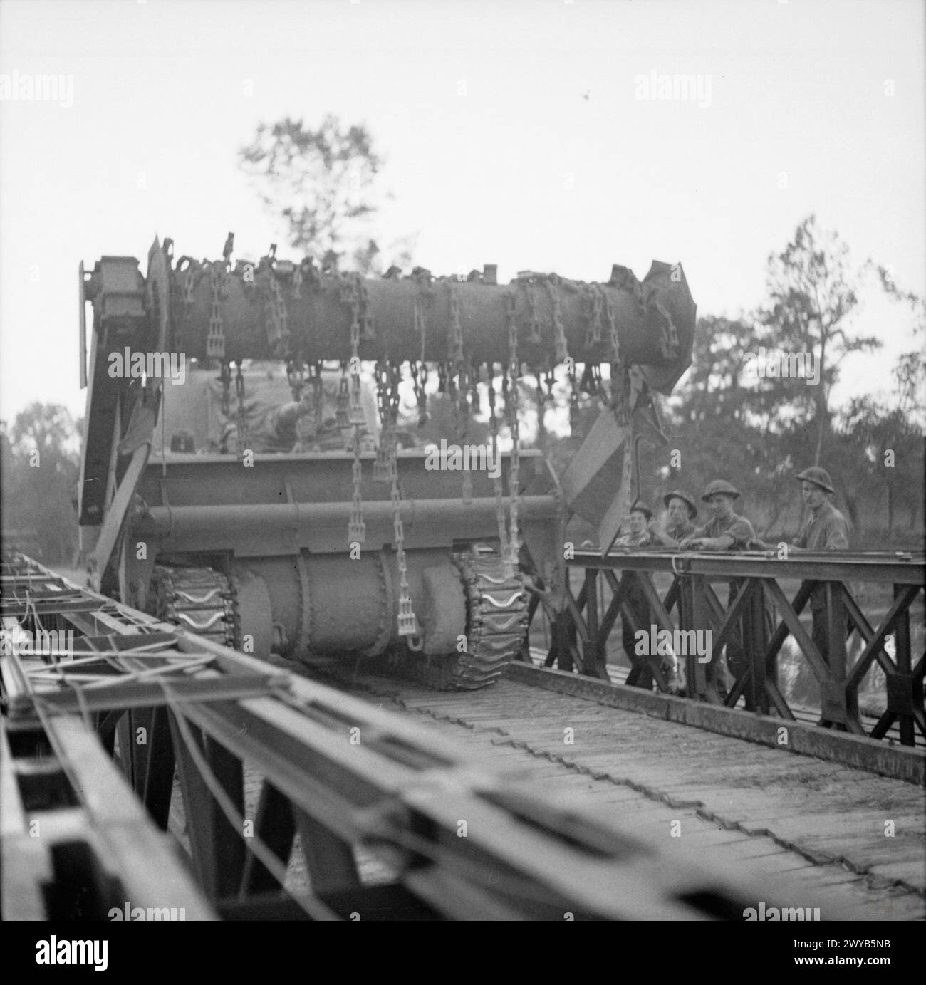 A Sherman Crab flail tank of the British Army crosses a Bailey bridge ...
