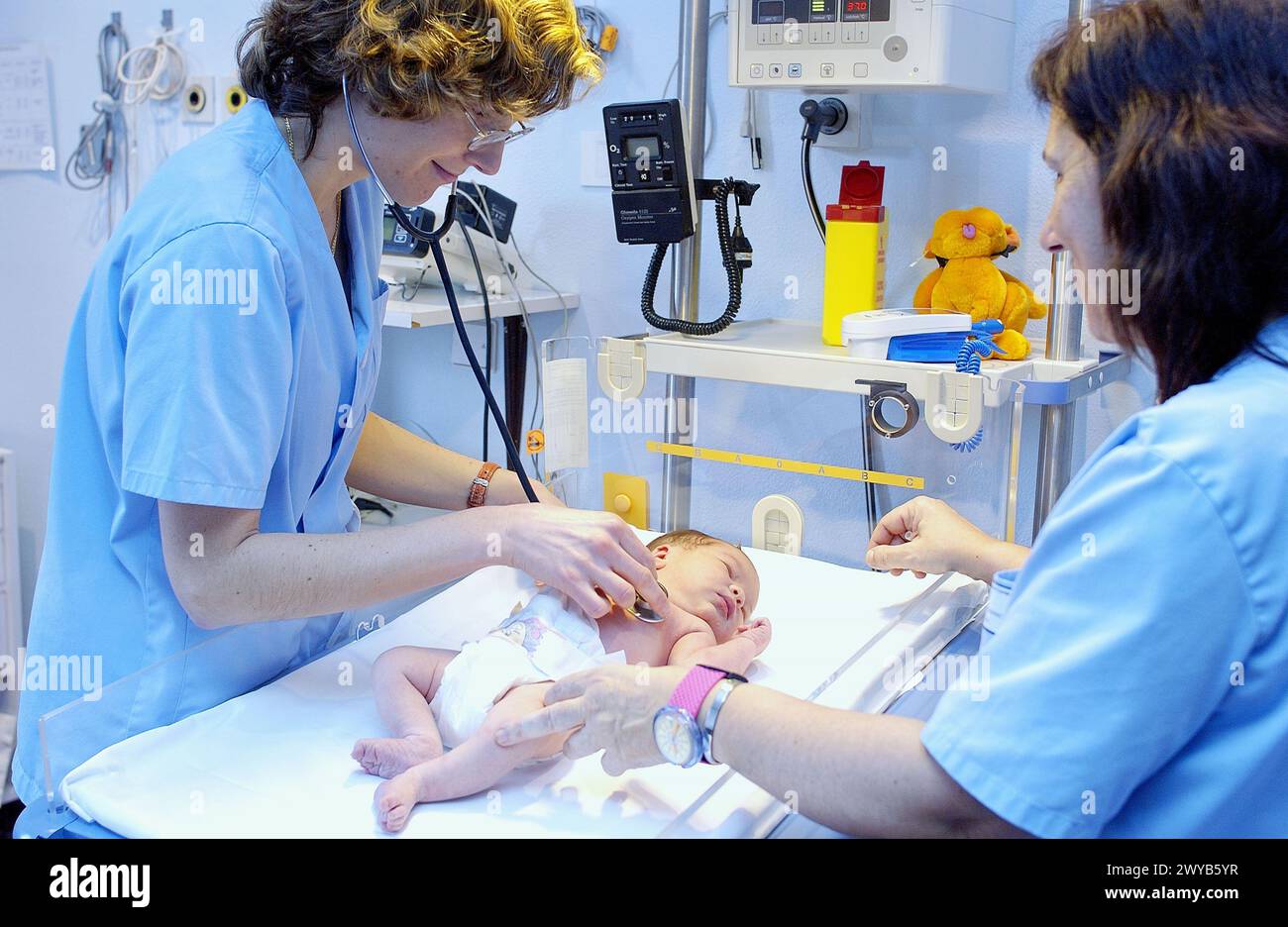 Nurse examinating baby at hospital Stock Photo - Alamy