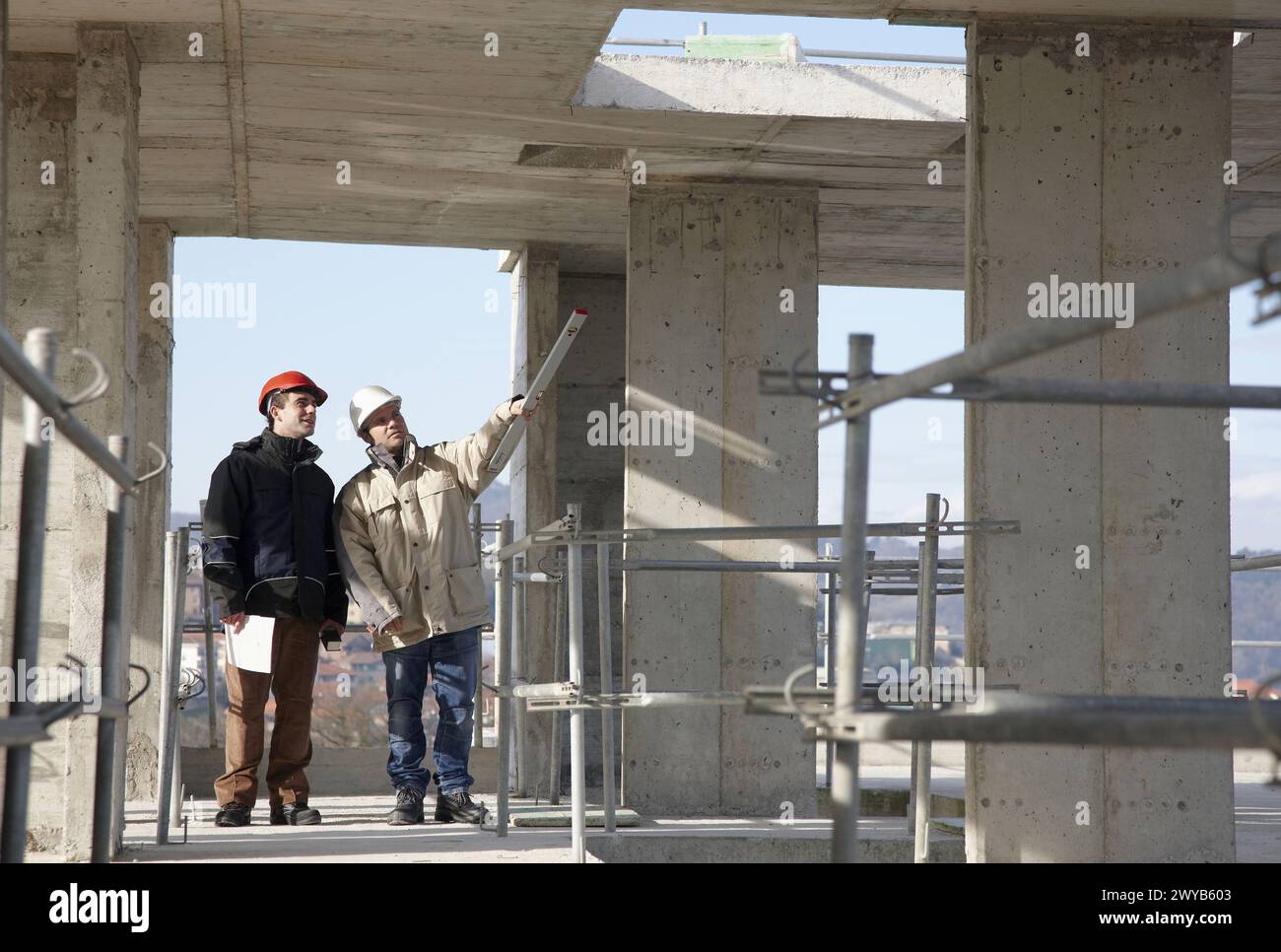 Architect and construction worker, personal protective equipment ...