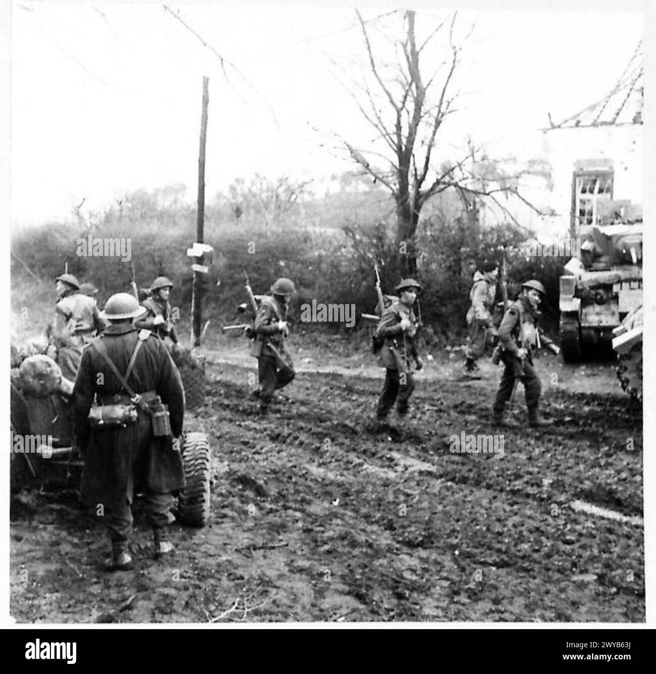 BRITISH-CANADIAN ATTACK - Original wartime caption: Infantry move on ...