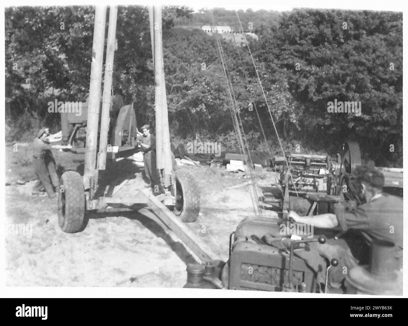 CROSS CHANNEL PIPE LINE - Original wartime caption: Lowering a part of ...