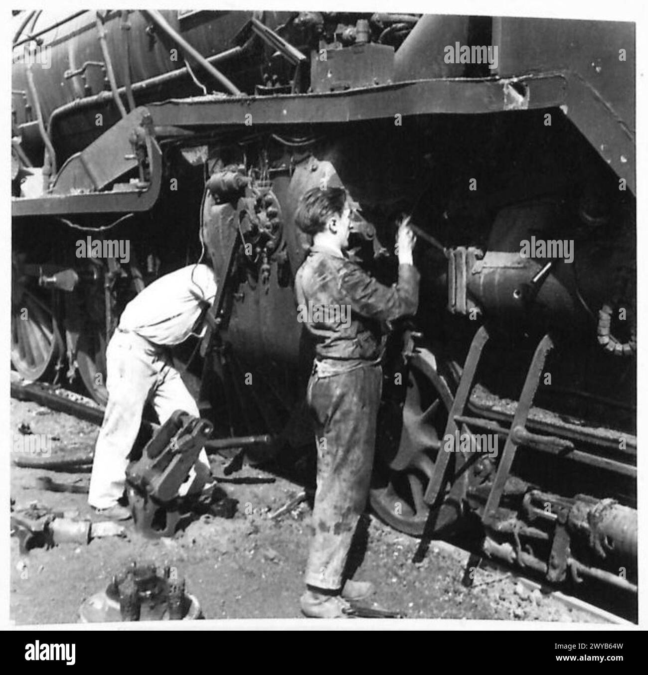 CAEN TO CHERBOURG RAILWAY OPENED - Original wartime caption: Two French ...