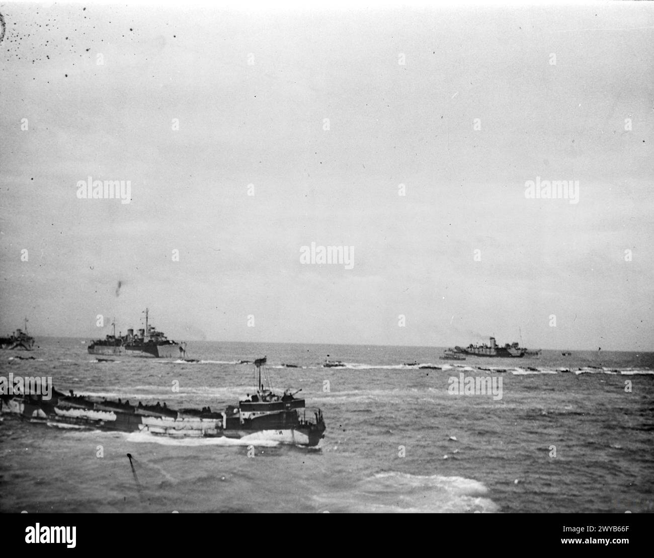 Landing craft and other ships are observed from the destroyer HMS ...