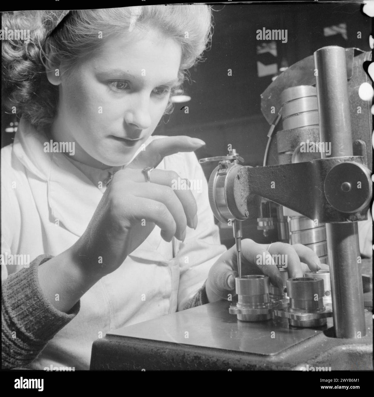 Jane Wales inspects a Camshaft Bush on a Comparator at a Rolls Royce ...