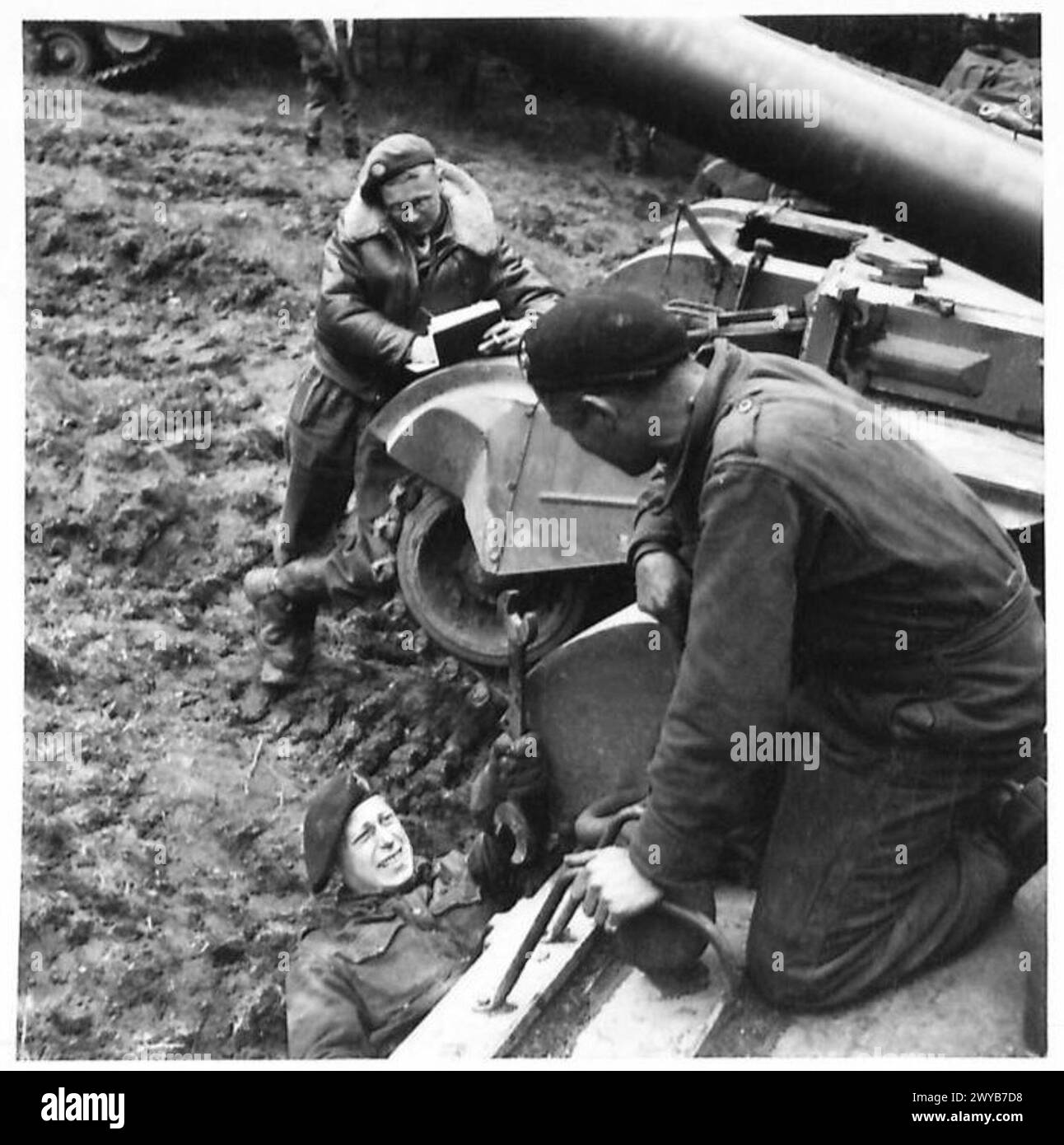 GILES IN GERMANY - Original wartime caption: He is attracted by two men ...