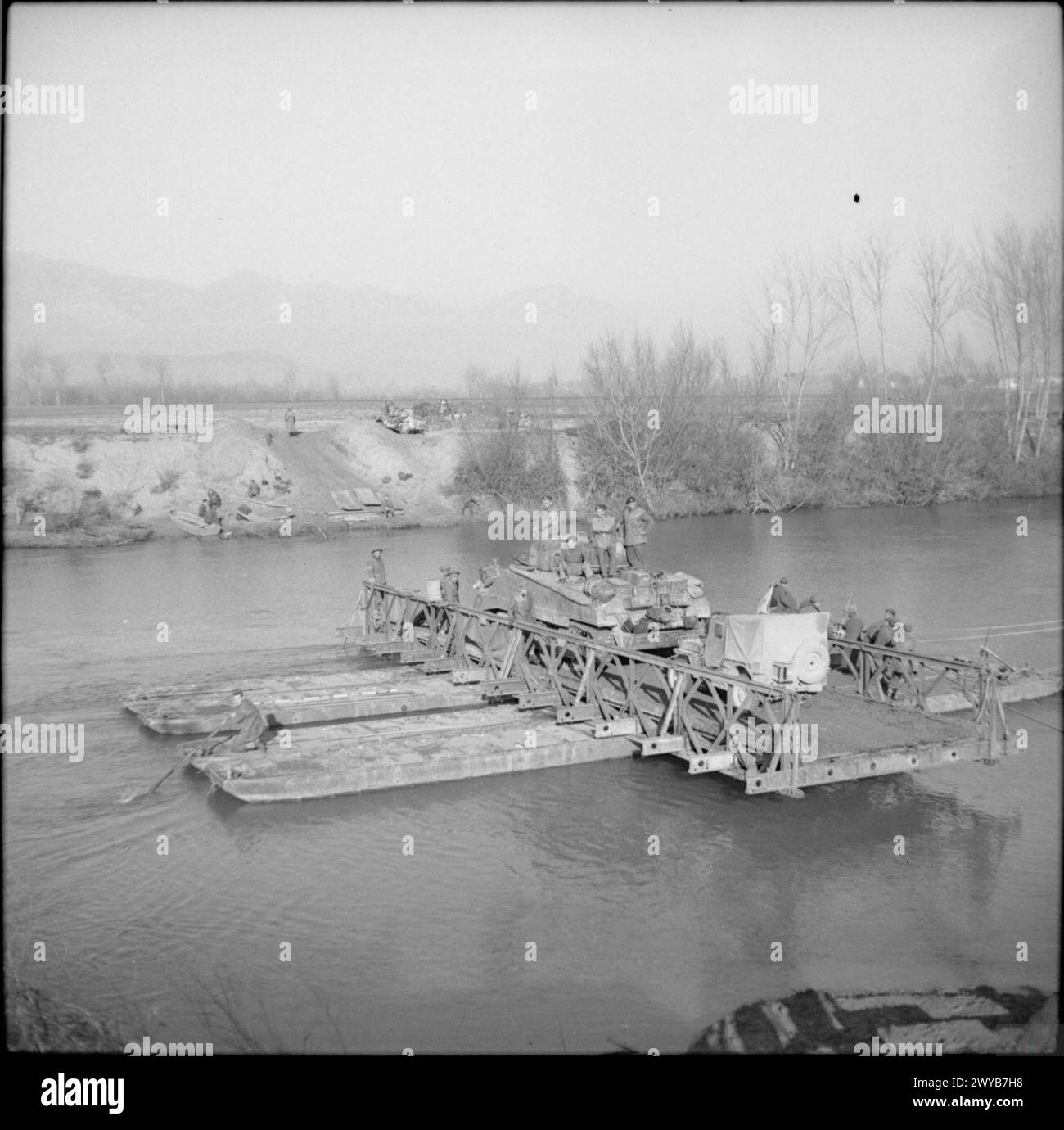 A Sherman tank of the British Army is rafted across the River ...