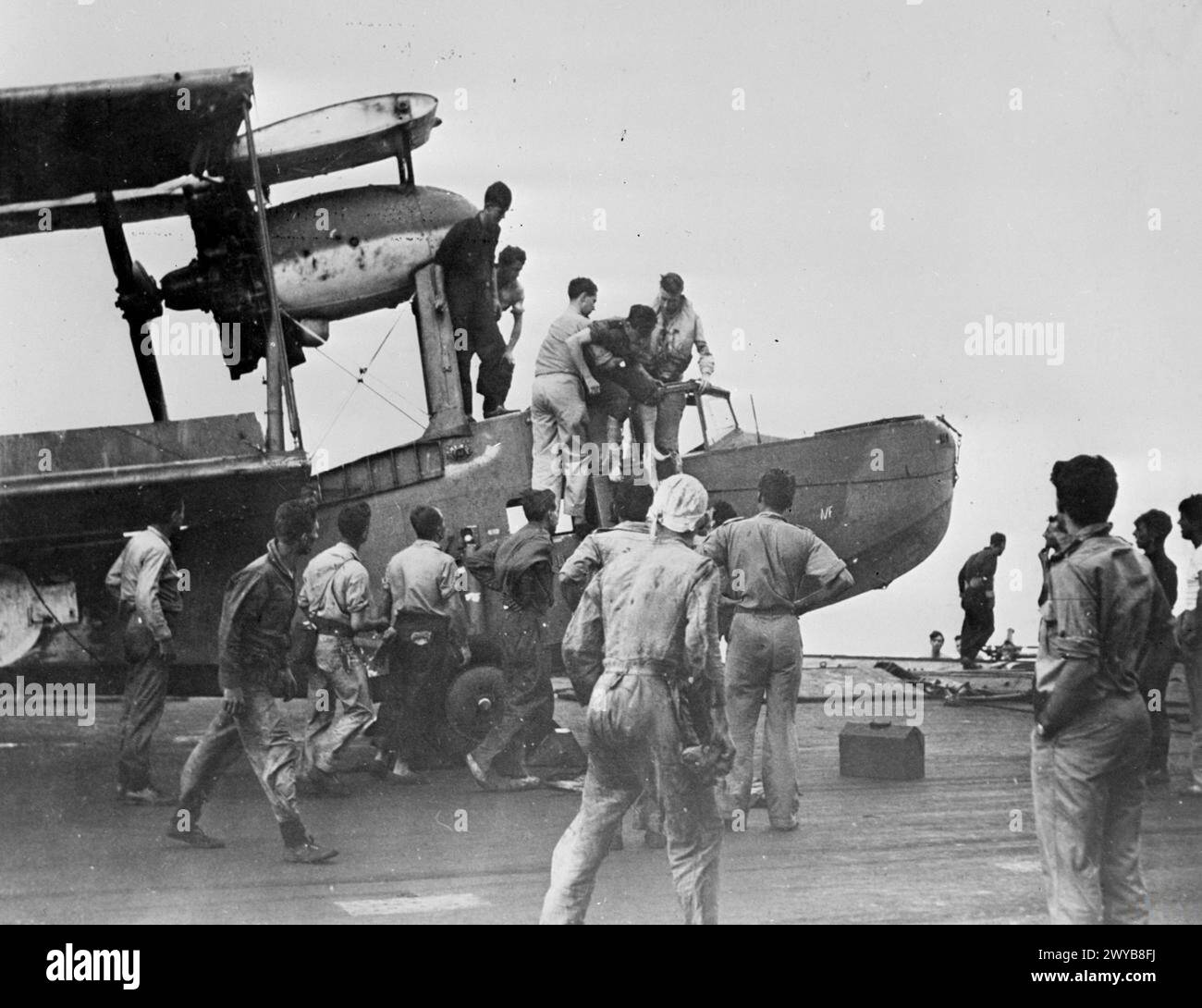 A British naval pilot, shot down near the shore during operations ...