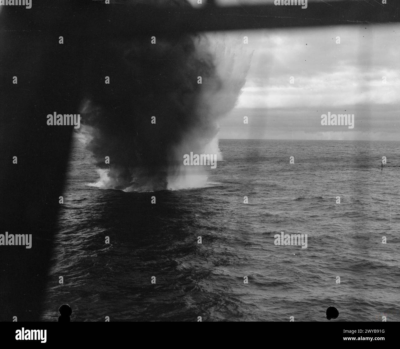 Convoy PQ 18 sails to an Arctic port in September 1942 under attack ...