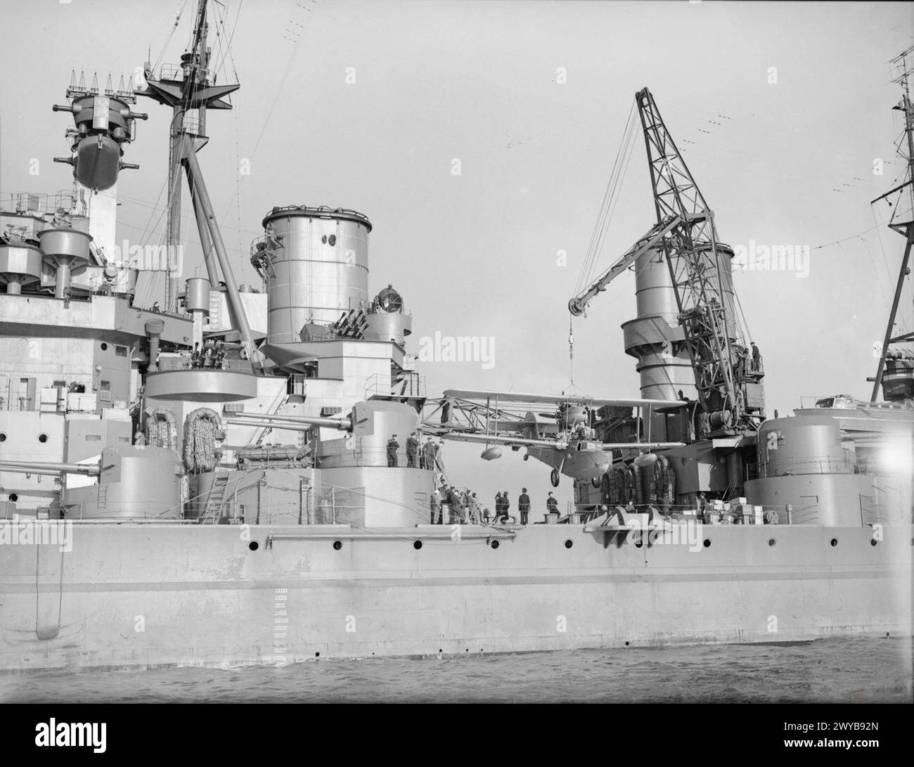 ON BOARD THE BATTLESHIP HMS PRINCE OF WALES. 20 APRIL 1941. - Hoisting ...