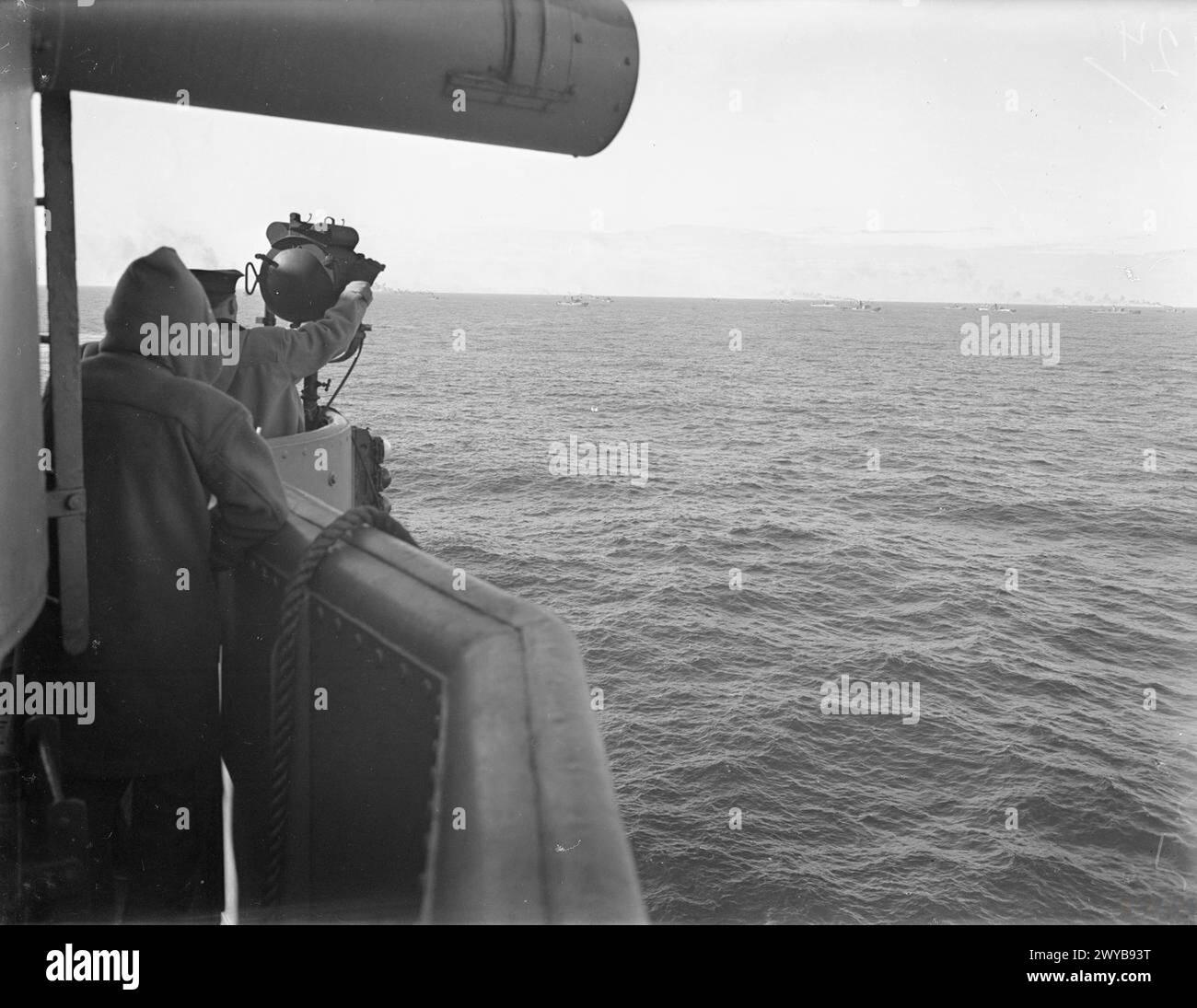 ON BOARD THE BATTLESHIP HMS RODNEY AT SEA. 1940. - Signalling from the ...