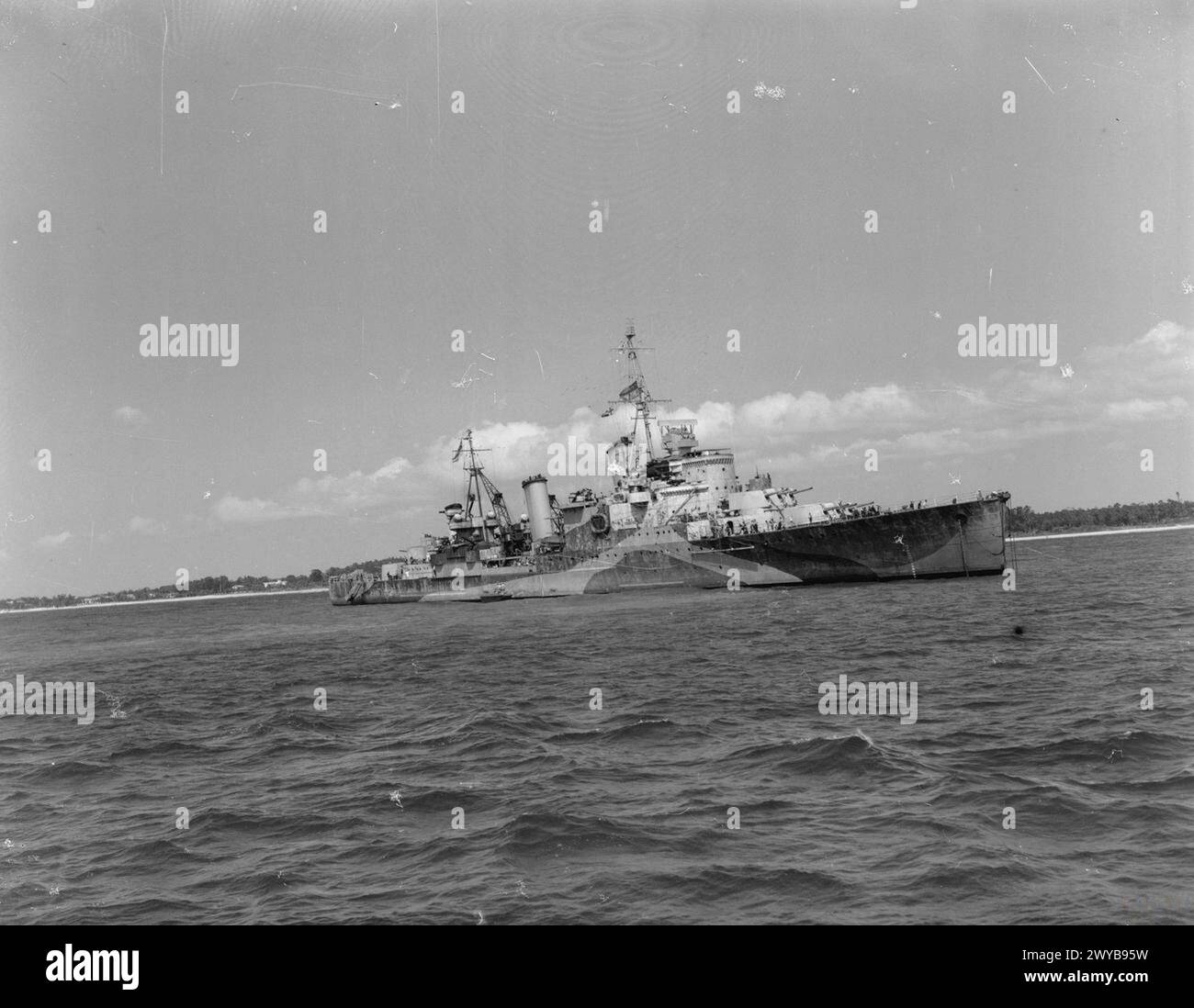 HMS Birmingham, a British cruiser, is anchored off Tamatave, Madagascar ...