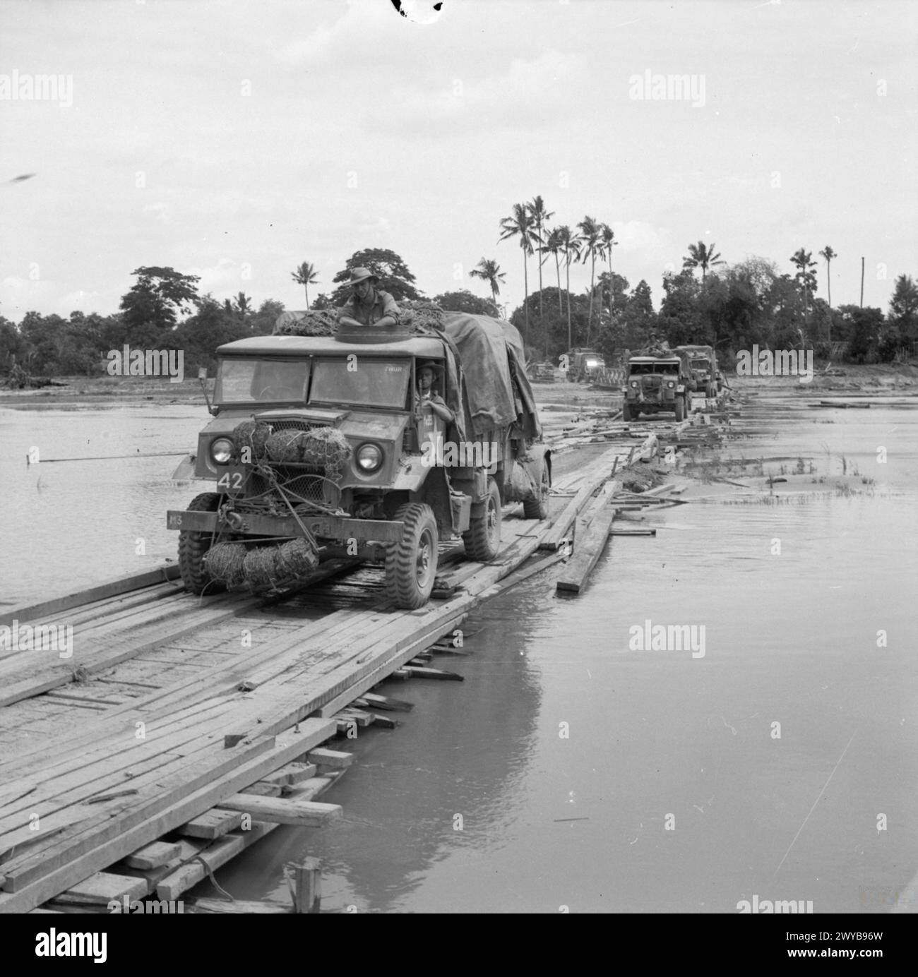 THE BRITISH ARMY IN BURMA 1945 - CMP 3-ton trucks make their way across ...