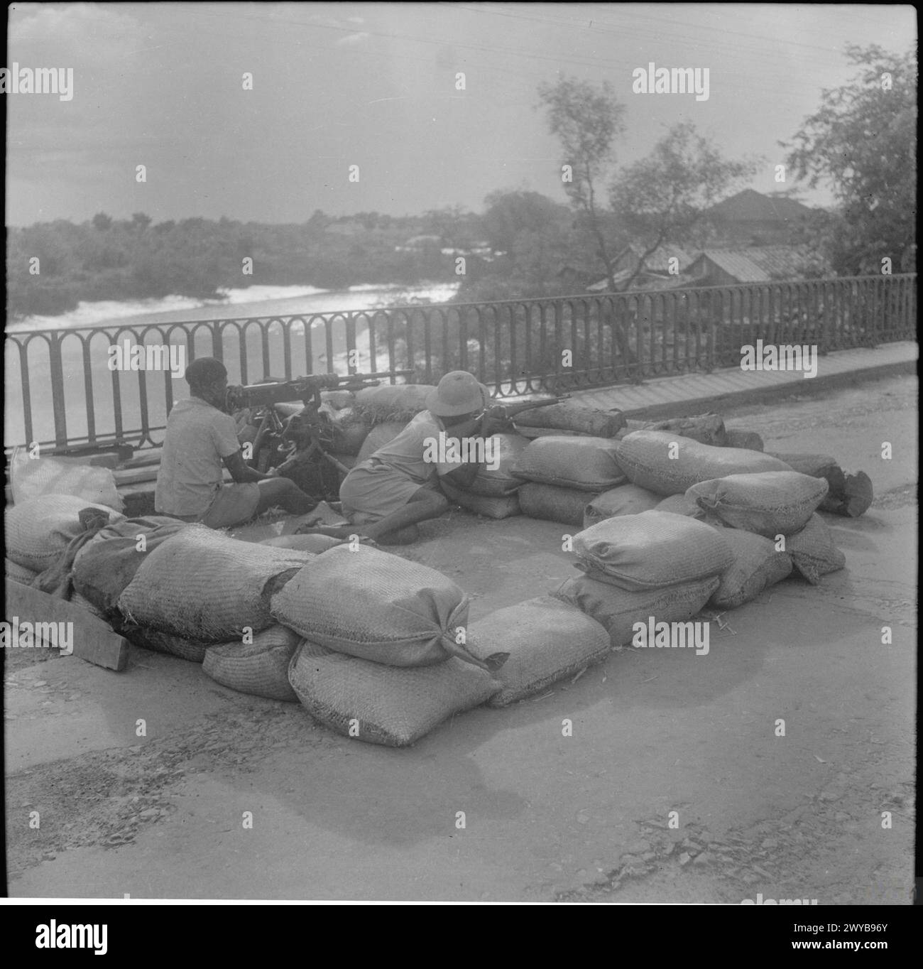 SAIGON, OCTOBER 1945 - French troops guard a bridge over the Saigon ...