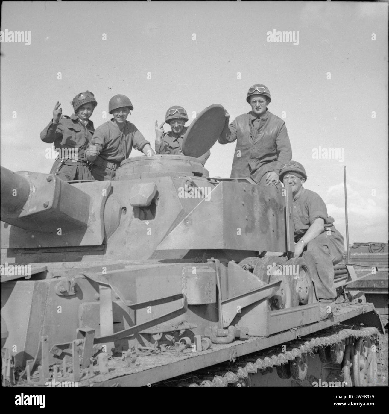 THE BRITISH ARMY IN NORMANDY 1944 - The crew of a Sherman ARV pose with ...