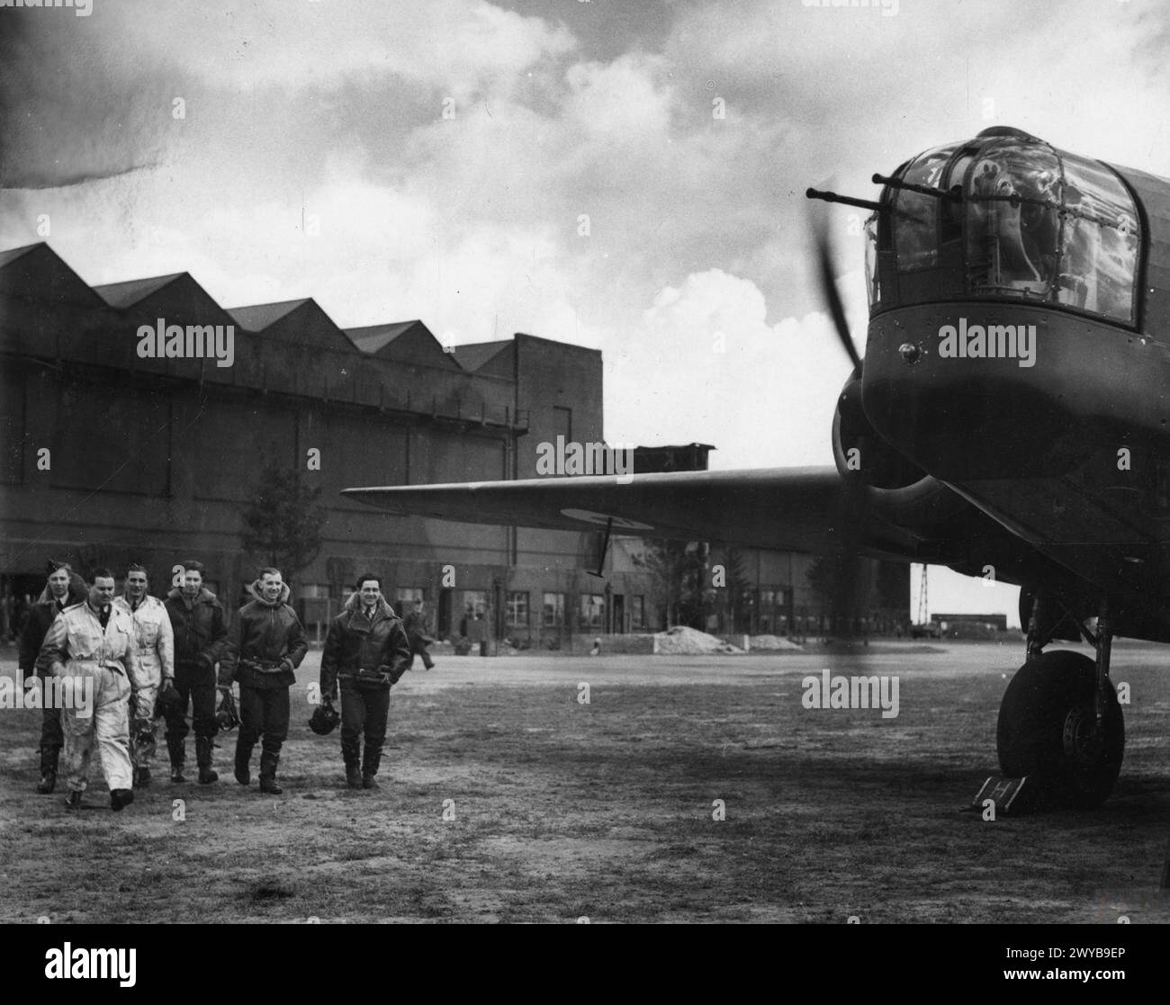 RAF BOMBER COMMAND - Aircrew approach a Vickers Wellington Mk I running ...