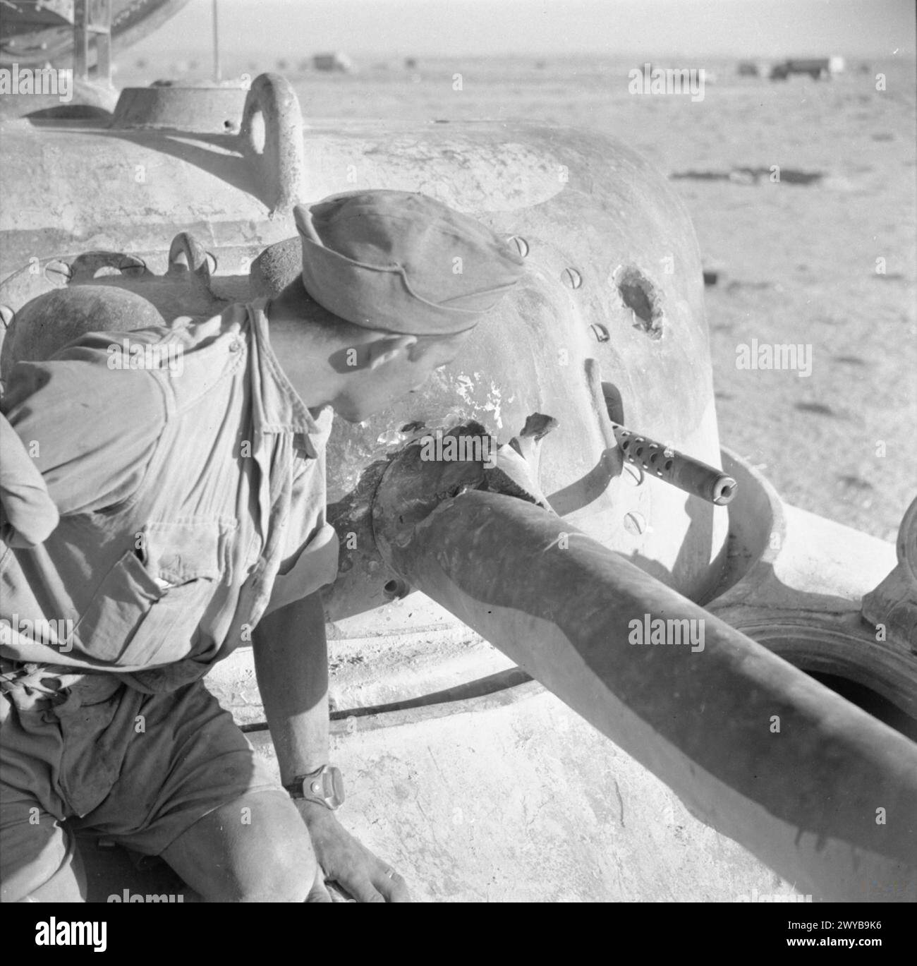 In October 1942, a REME soldier examined damage to a Sherman tank ...